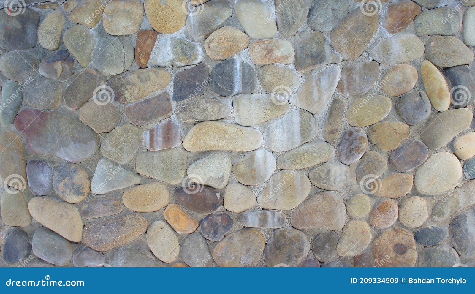 Wall Built of Rounded Colored Stones. Texture of Rounded Colored Stone ...