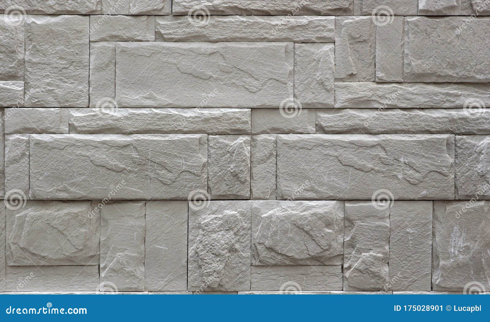 Wall Cladding Made of Rough Light Gray Natural Stones. Background and ...