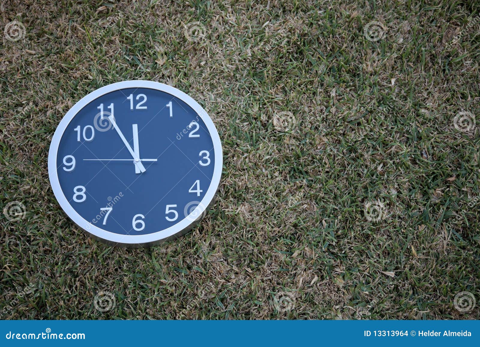 Wall clock in the grass stock photo. Image of chrome - 13313964