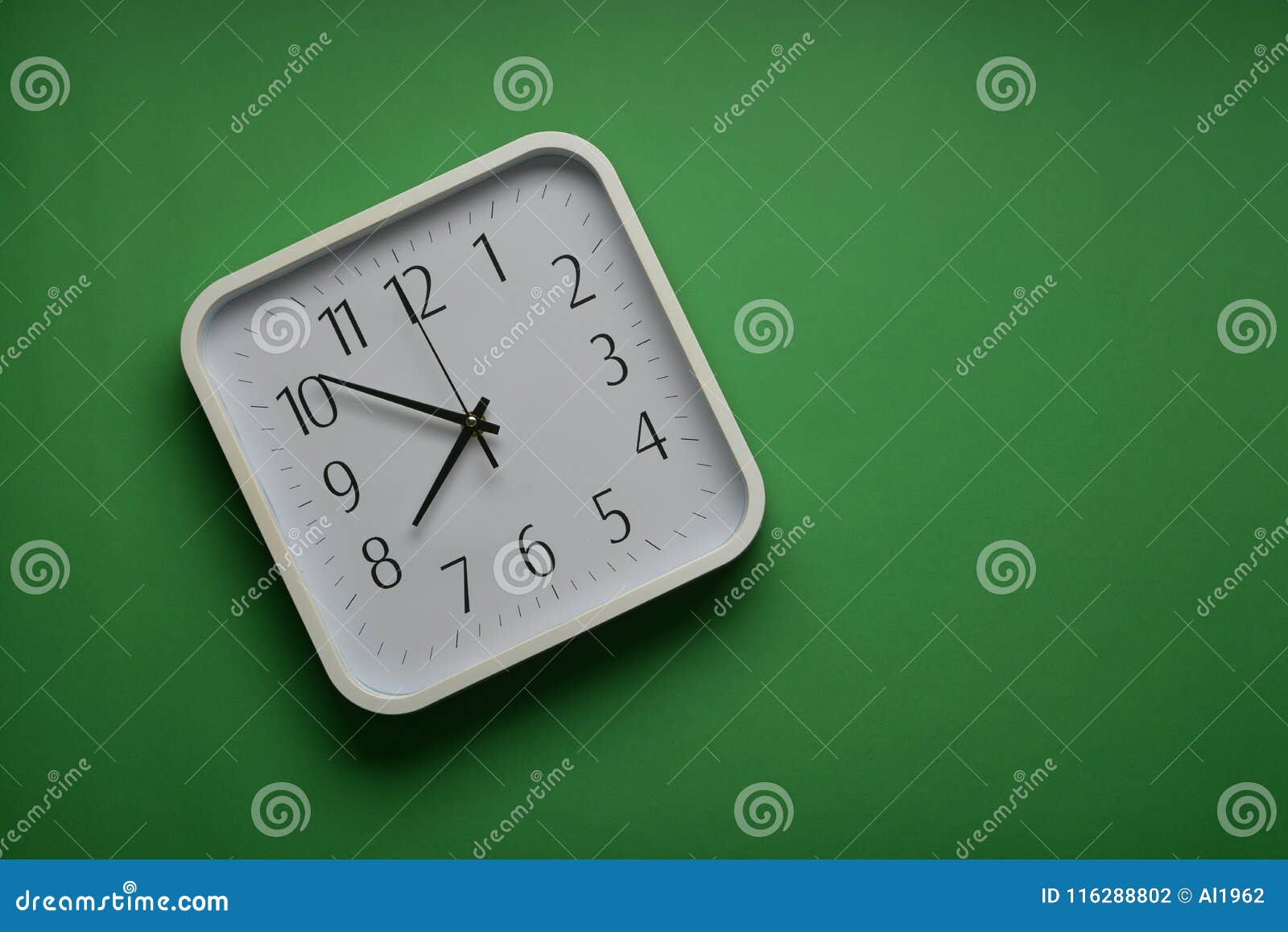 Wall Clock on the Green Background Stock Photo - Image of watch ...