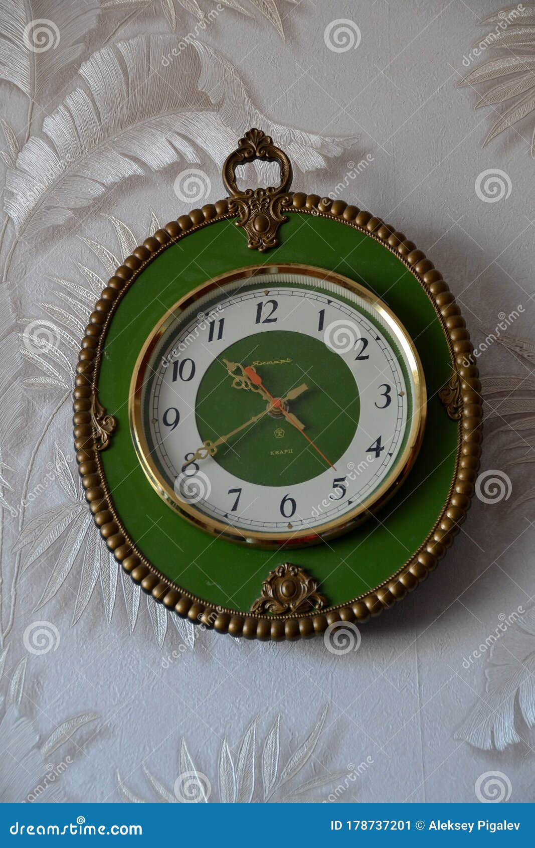 Wall Clock in a Green Rim, Decorated with Decorative Elements Stock ...