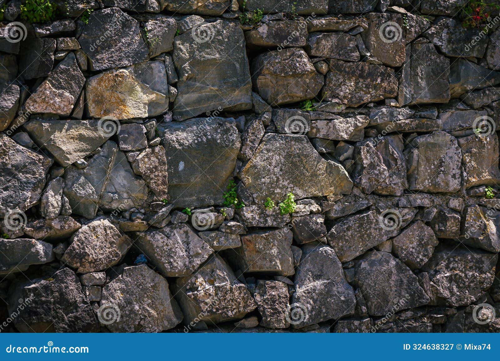 Granite Stones of Different Shapes and Colors. Wall Cladding. Stock ...