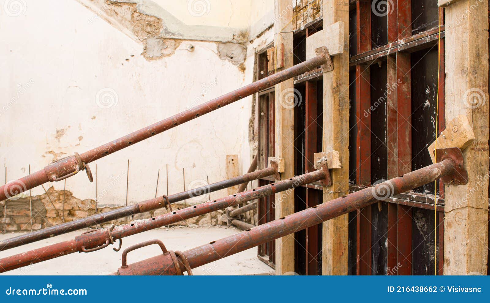 Wall of a Construction Site with Iron Props and Reinforced Concrete ...