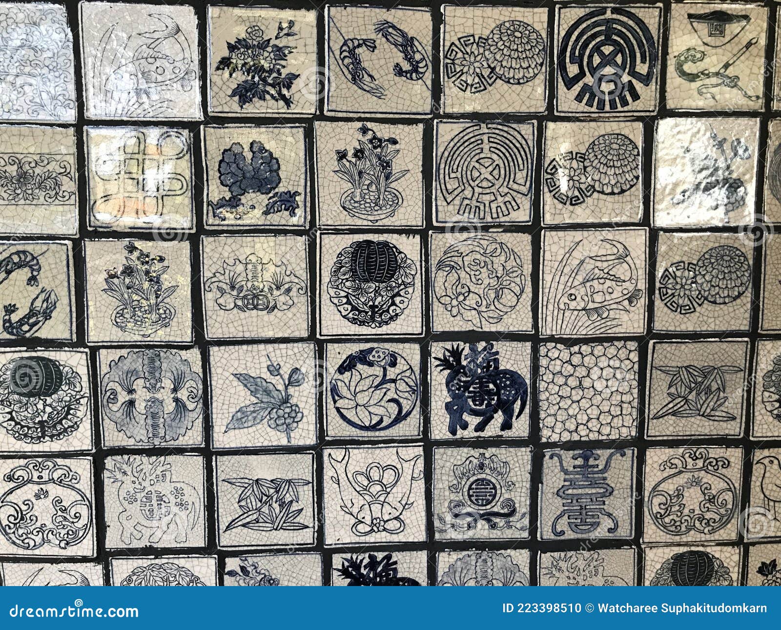 The Wall is Covered with Various Chinese Pattern Tiles. Stock Photo ...