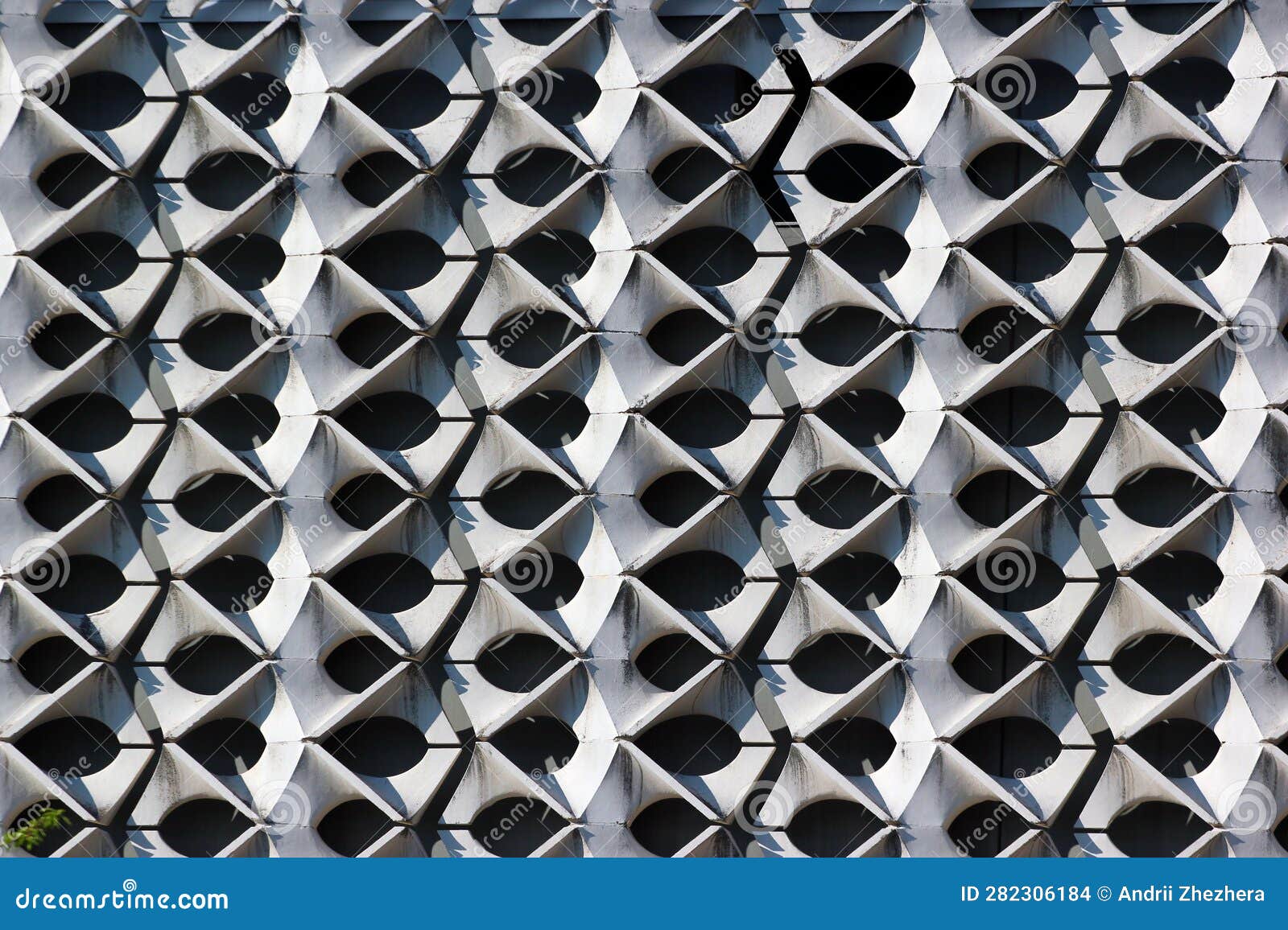 Wall Decorated of Concrete Relief with Cutouts. Regular Pattern and ...