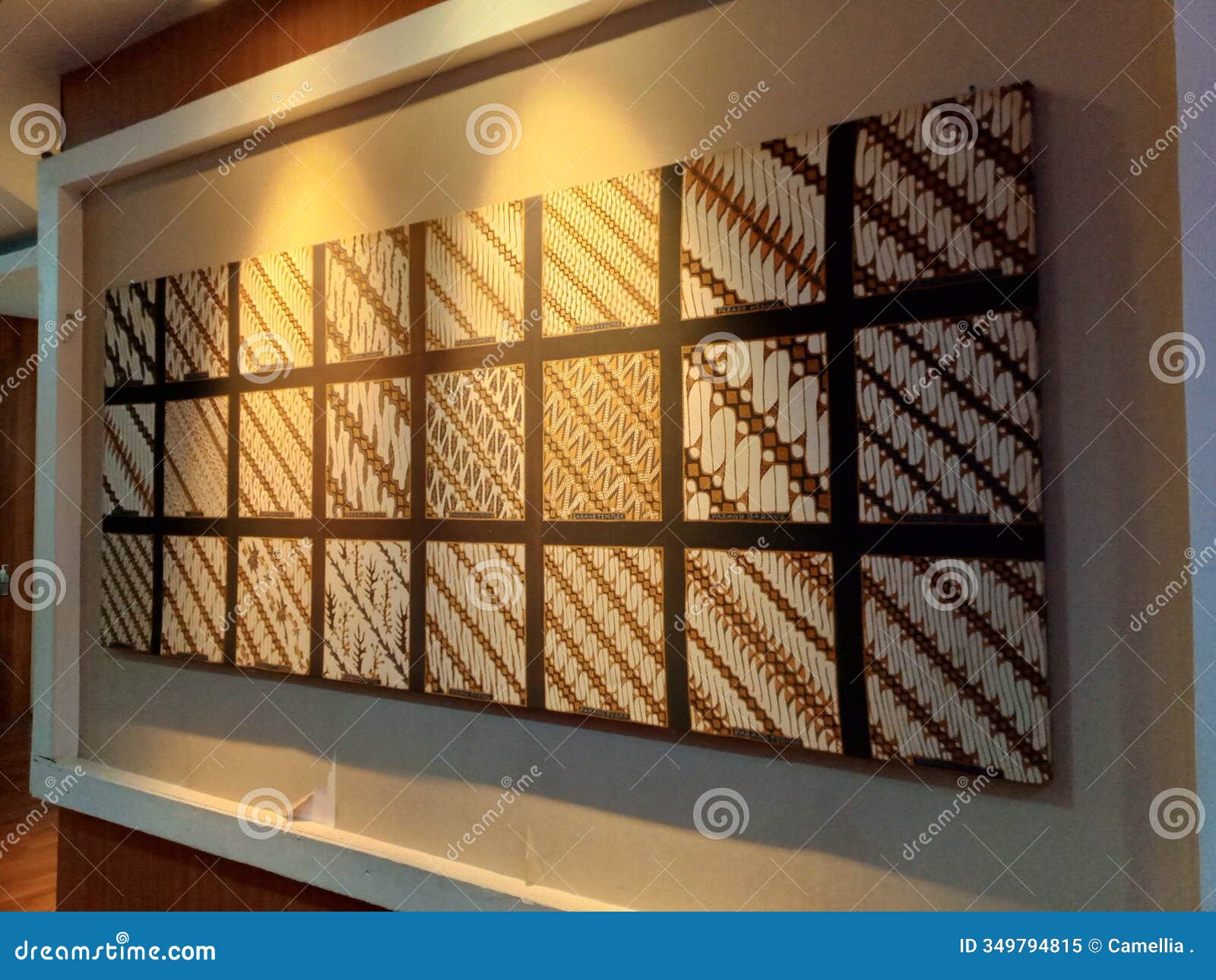 A Wall Display Showcases Various Traditional Indonesian Batik Patterns ...