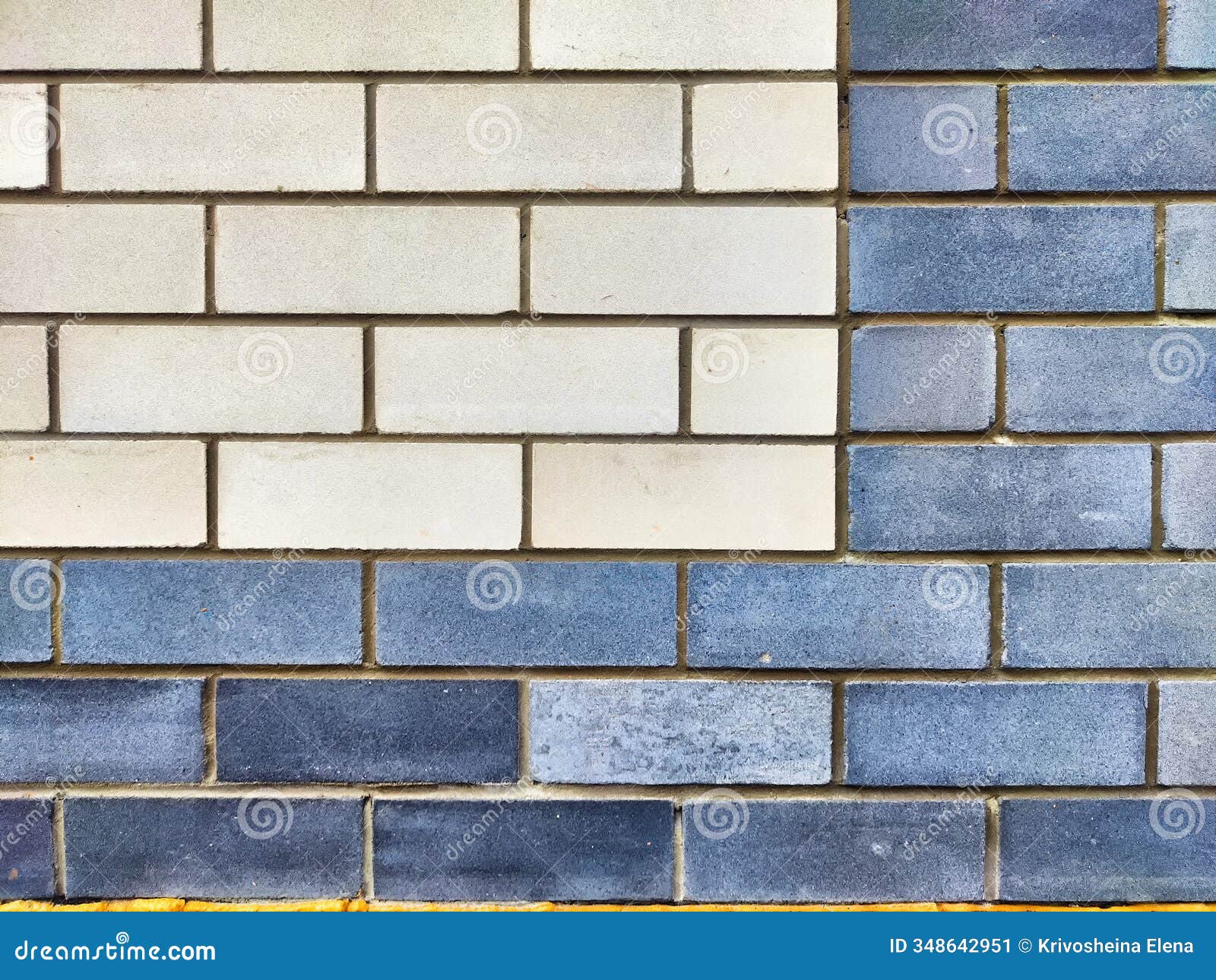 A Wall Displays a Striking Pattern of Alternating Light and Dark Bricks ...