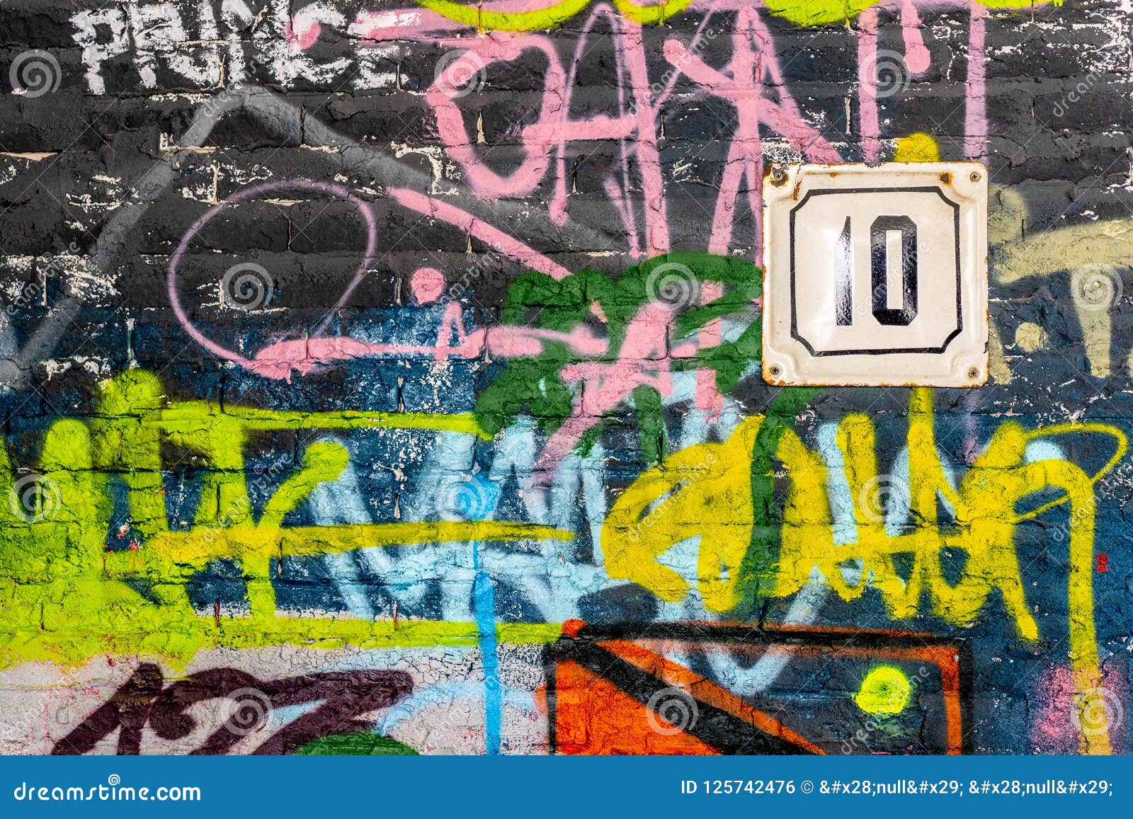 A Wall with Graffiti of Unknown Artists. Number of the House on the ...