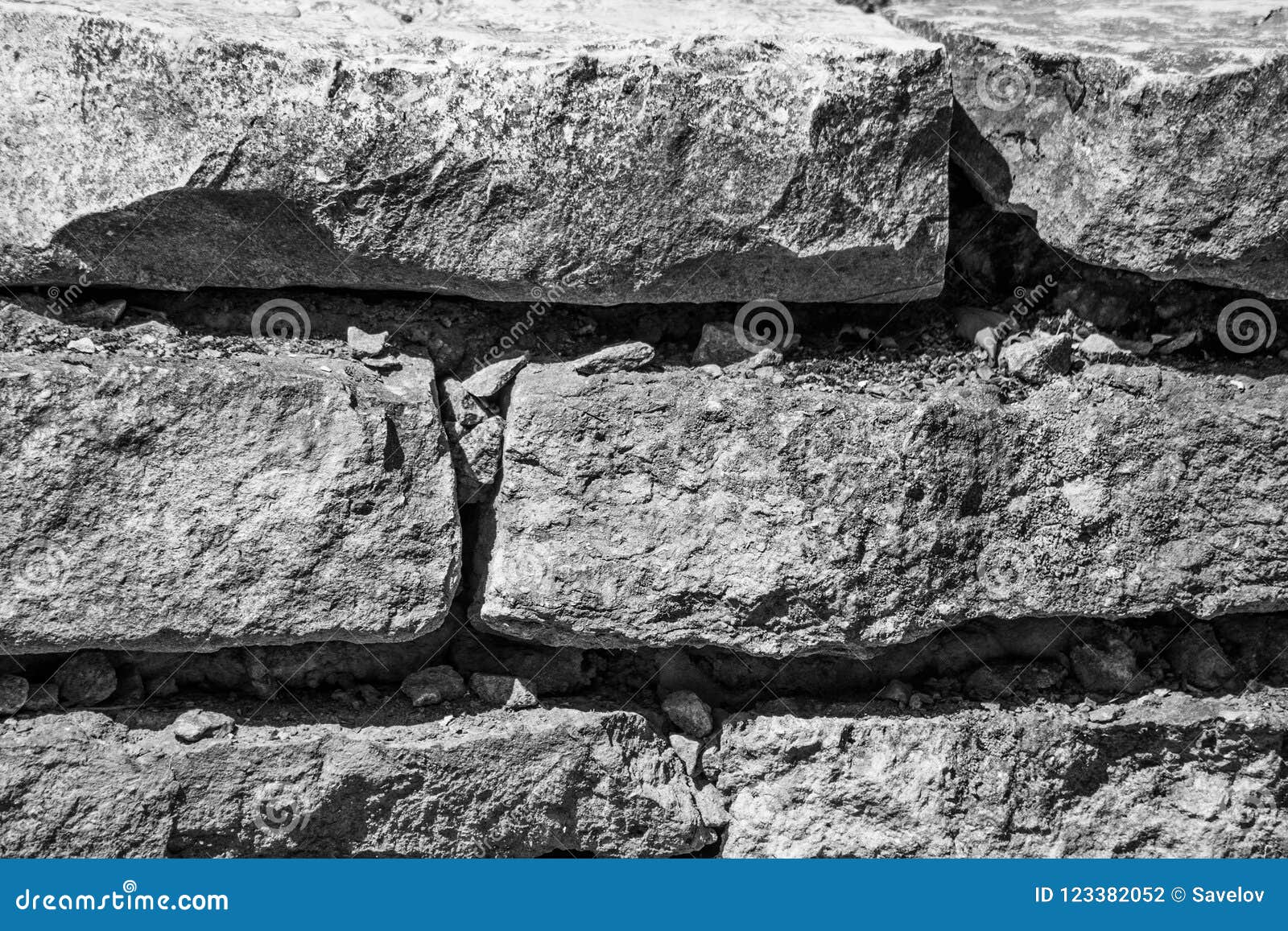 Wall of large rough stones stock photo. Image of ancient - 123382052