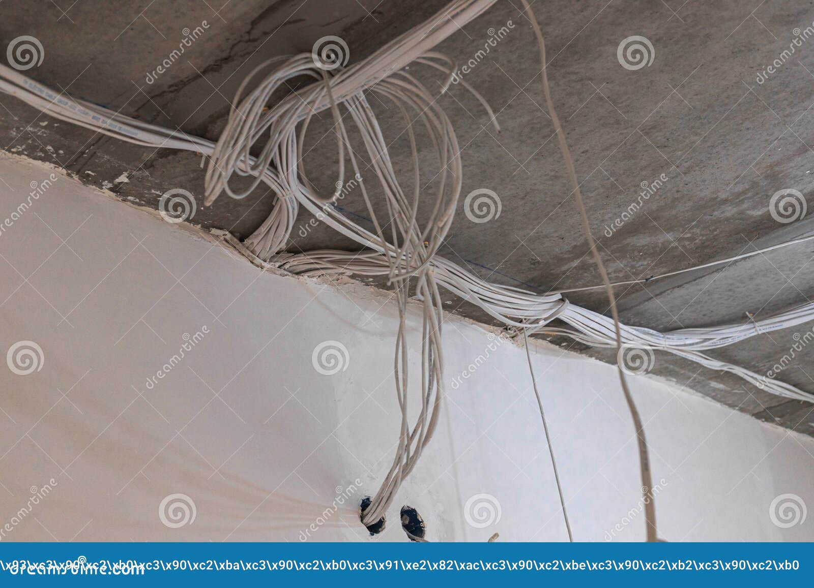 Wall is of Light-colored Plaster and Has Several Outlets. Professional ...