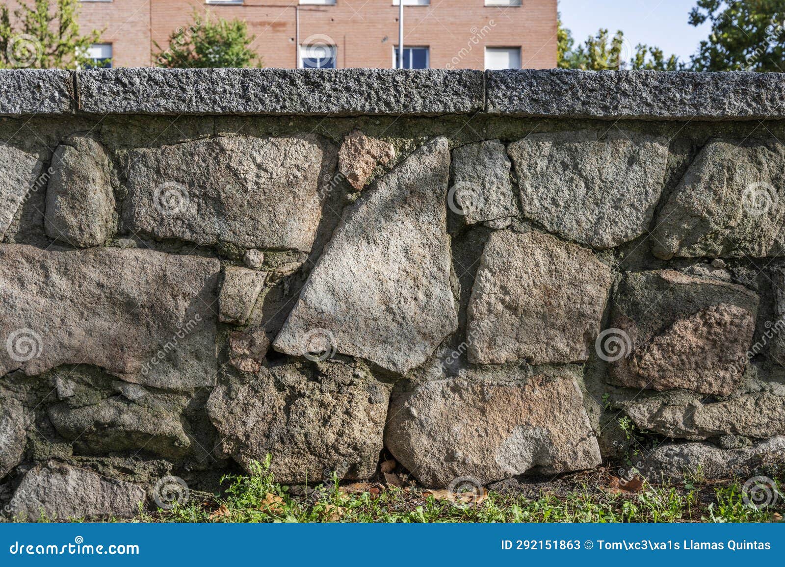A Wall of Light Granite Stones at the Edge of an Urban Park Stock Image ...