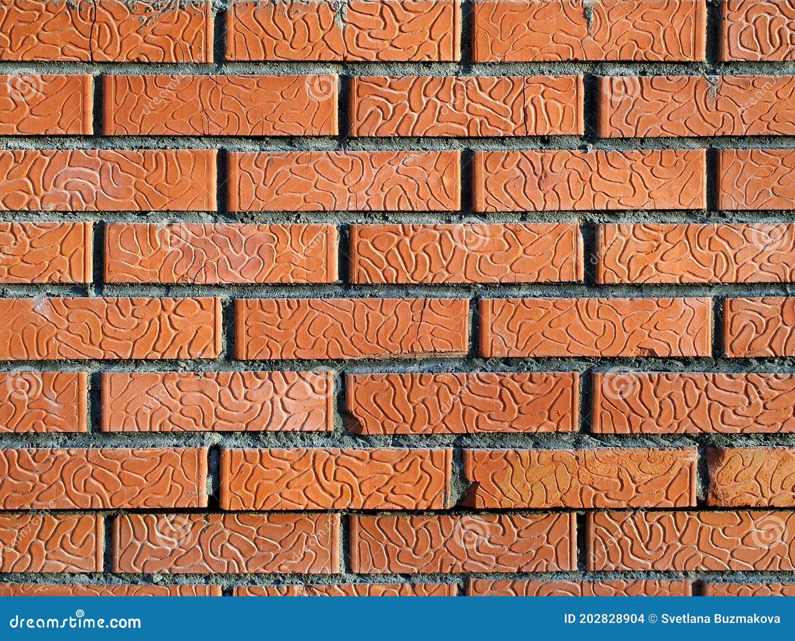 The Wall is Made of Decorative Red Bricks. on the Brick, Neat Grooves ...