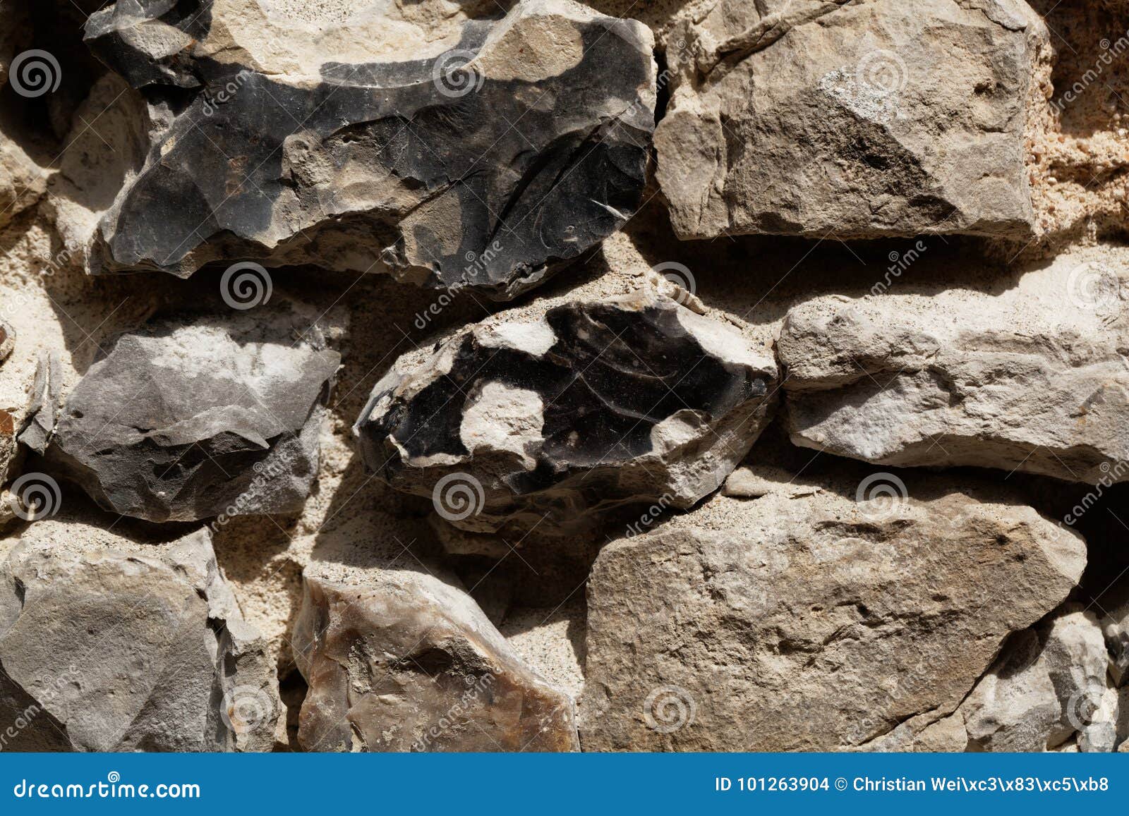 Wall made of flint stone stock photo. Image of pattern - 101263904