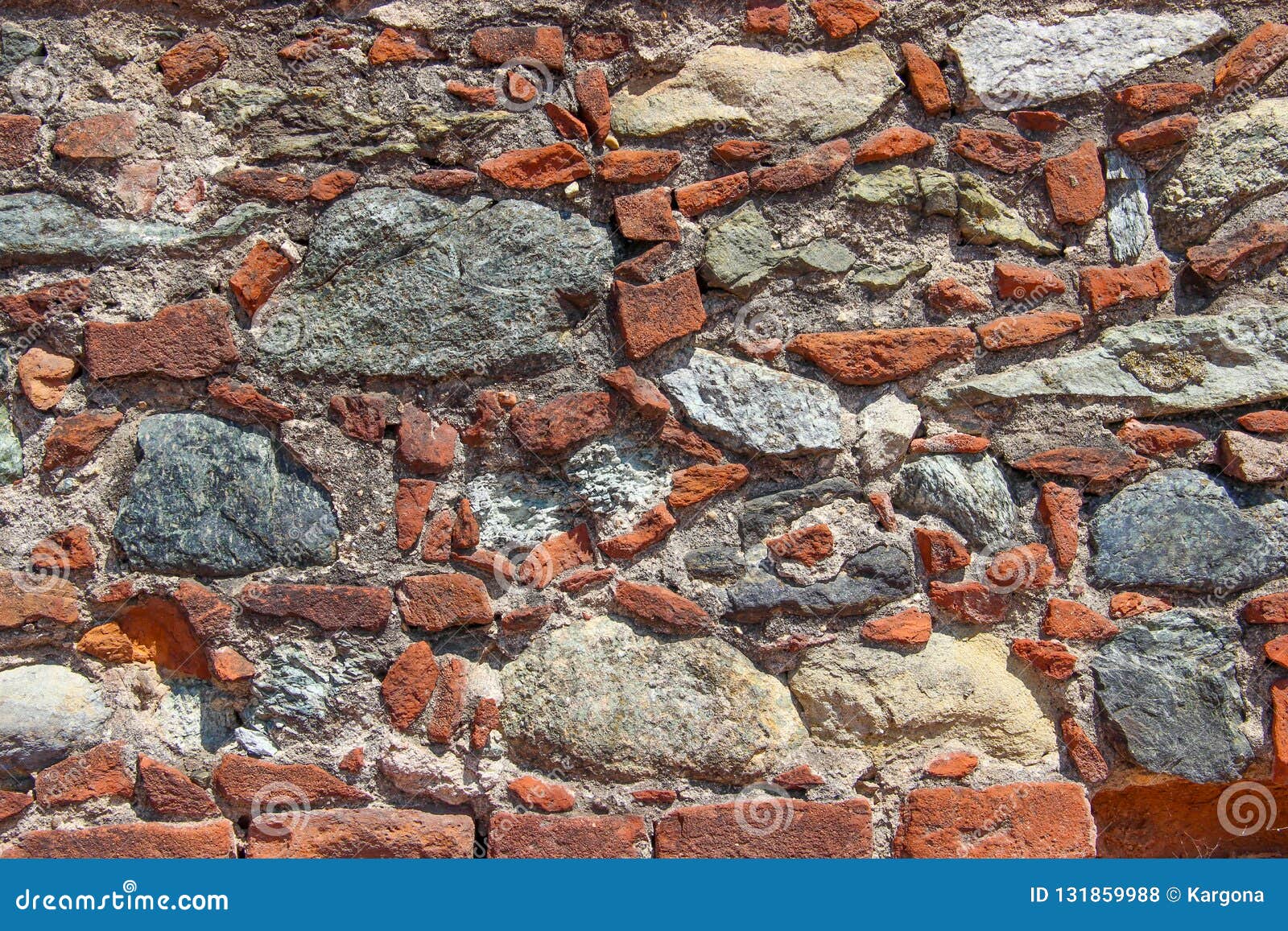 Wall Made of Natural Rocks, Bricks and Scrap Bricks Stock Photo - Image ...