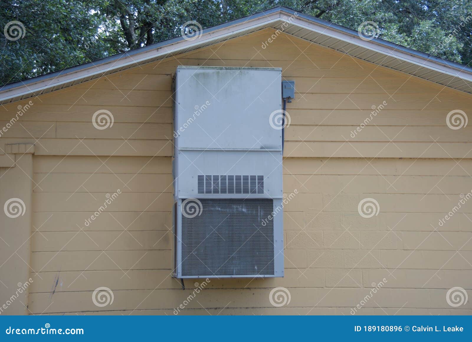Air Conditioner Wall Unit on a the Side of a House Stock Photo - Image ...