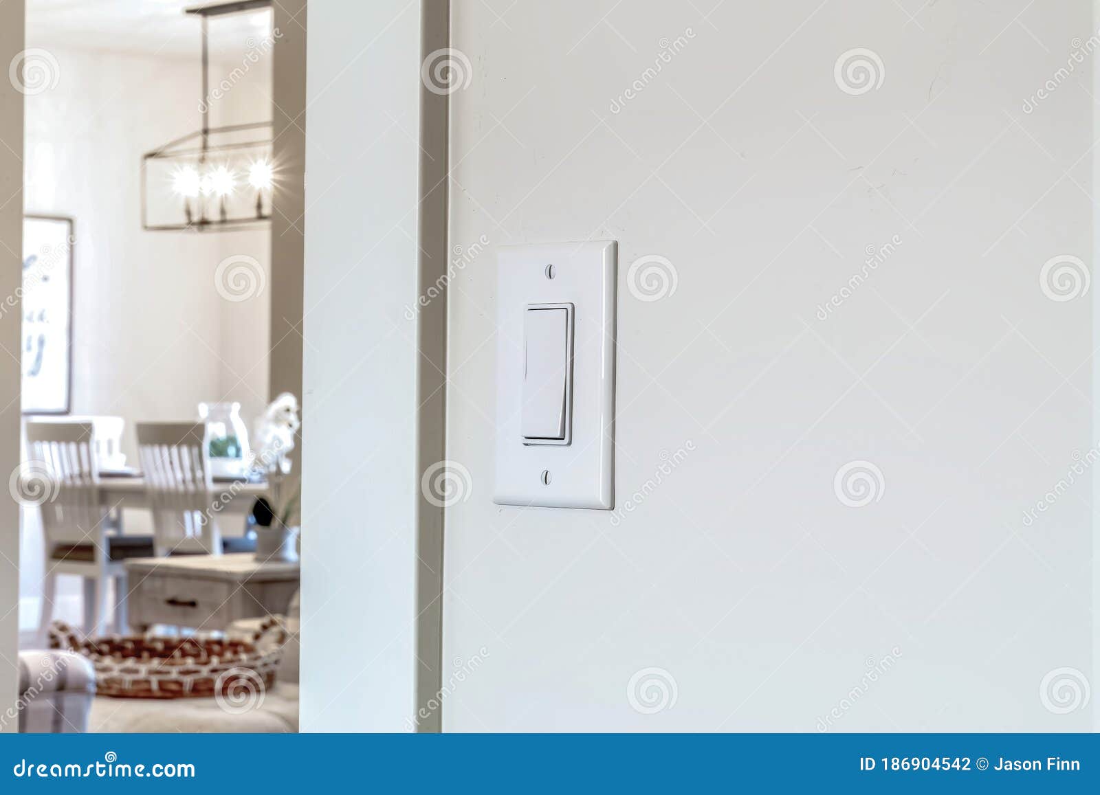 Wall Mounted Electrical Rocker Light Switch with Blurry Dining Room ...