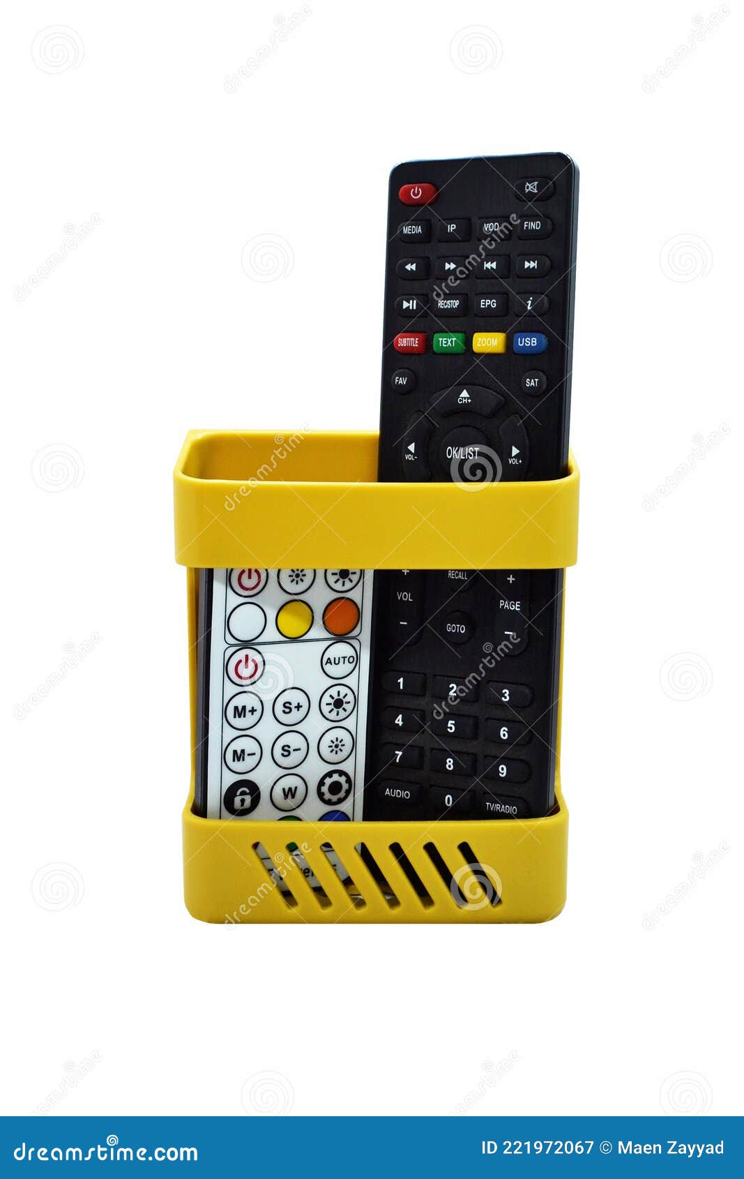Wall Mounted Plastic Organizer with Remote Controls in it Stock Image ...