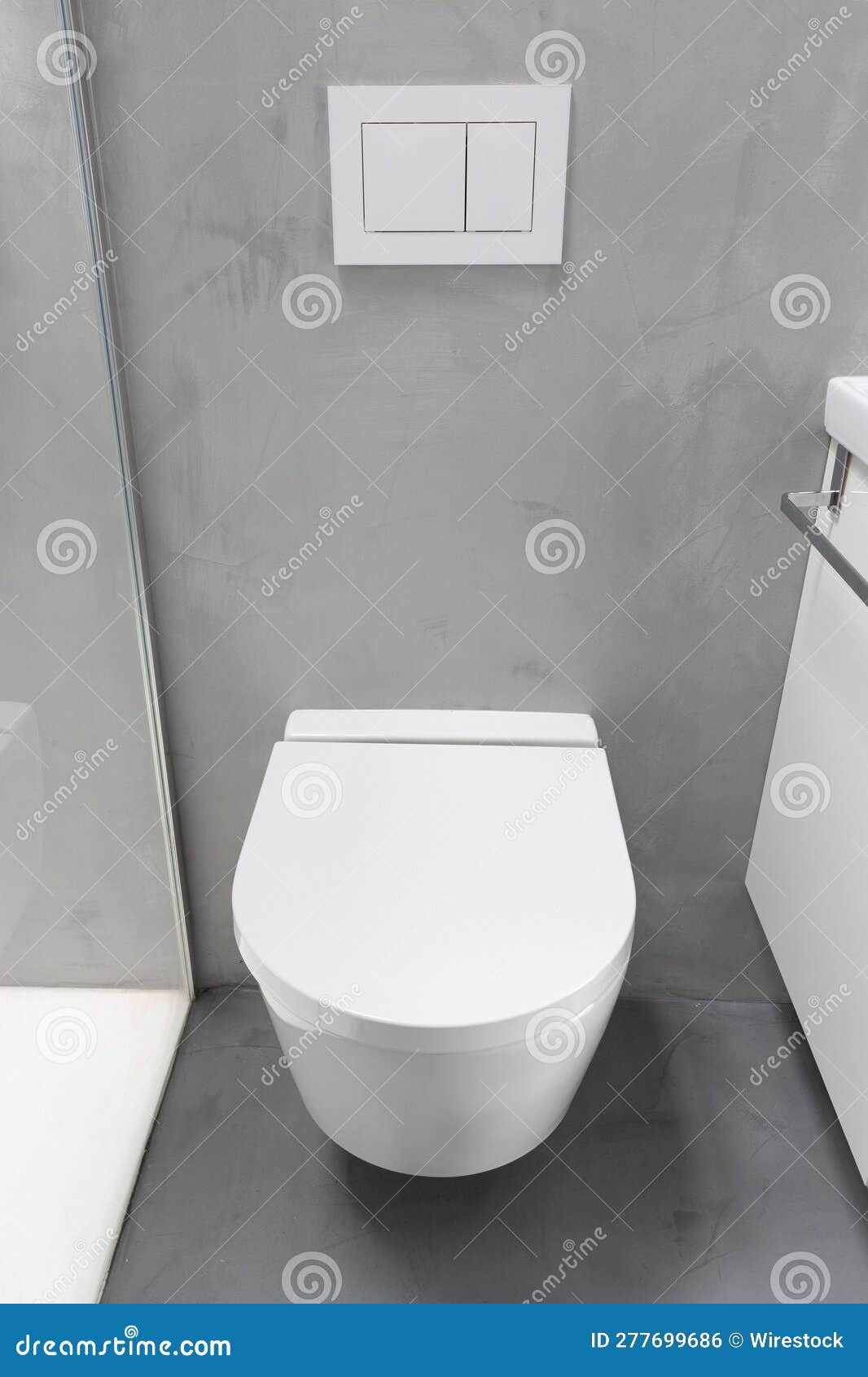 Wall Mounted Toilet of a Home Bathroom Stock Photo - Image of push ...