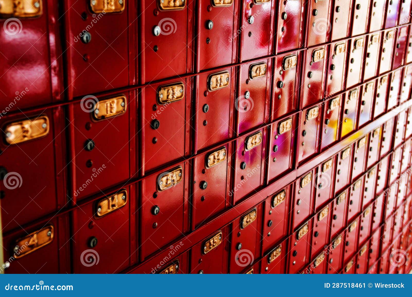 Wall of Multiple Red Mailboxes with Metal Doors, Each Featuring a Gold ...