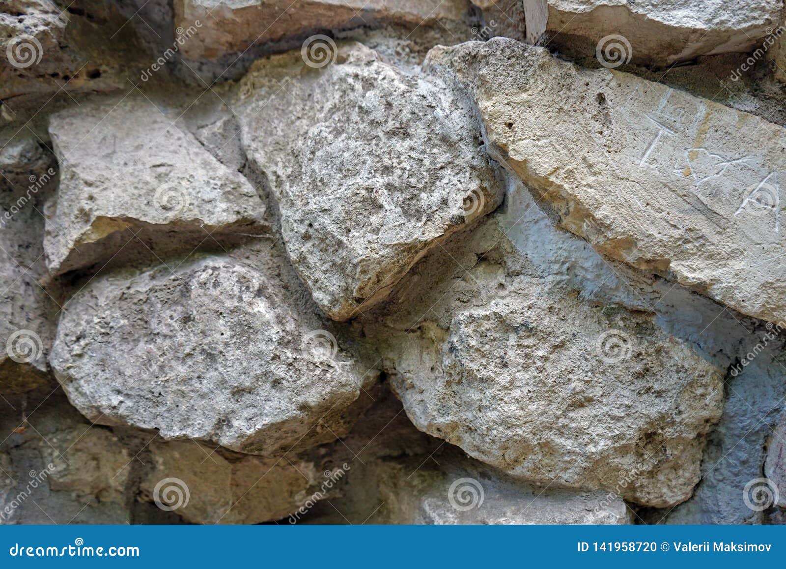 The Wall of Natural Stones of Different Sizes Stock Photo - Image of ...