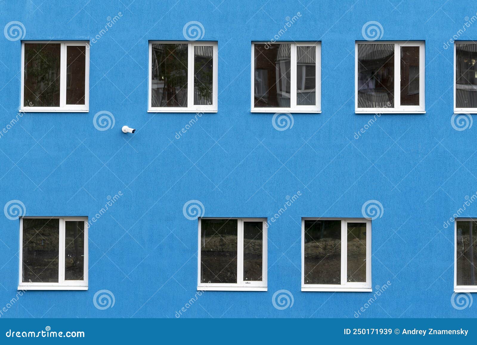The Wall of a New Blue House with Windows and a Surveillance Camera ...