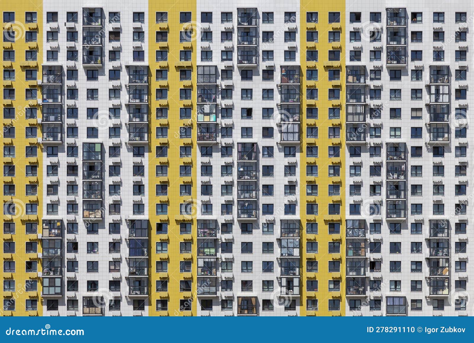 The Wall of a New High-rise Building in White and Yellow with the Same ...