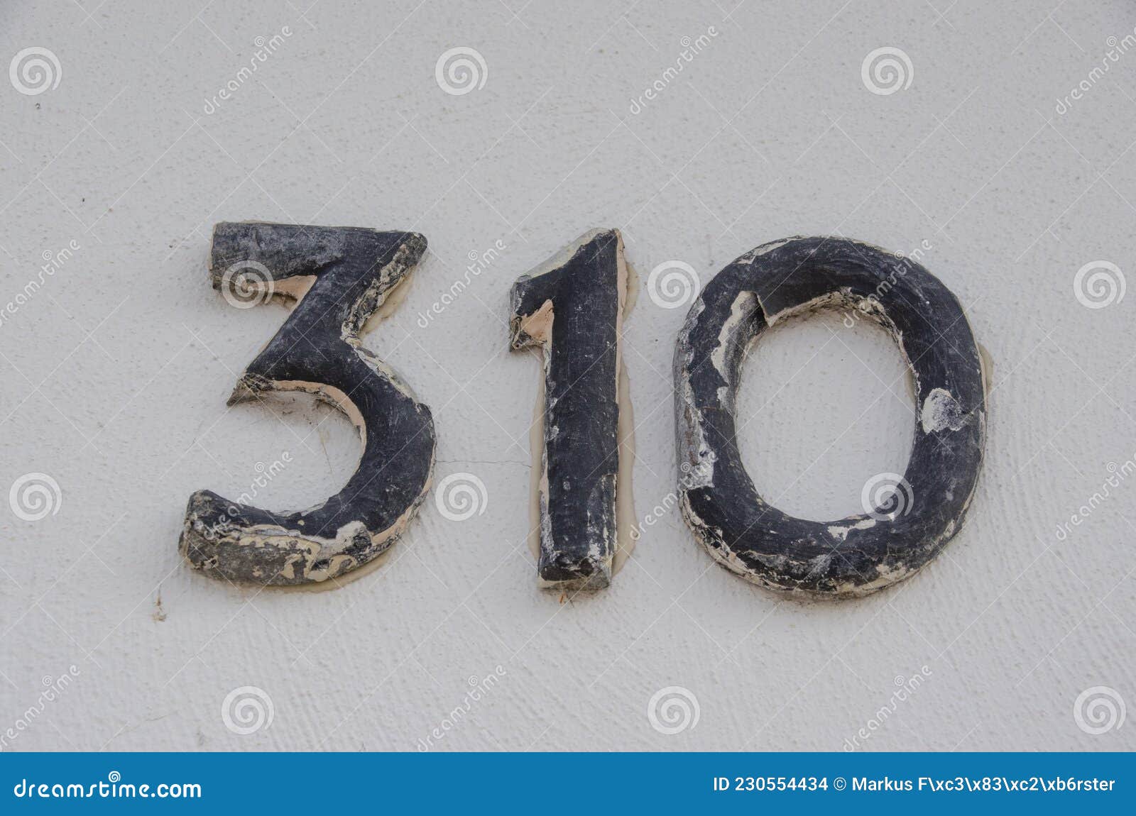 Wall with the Number Three Hundred Ten Stock Photo - Image of address ...