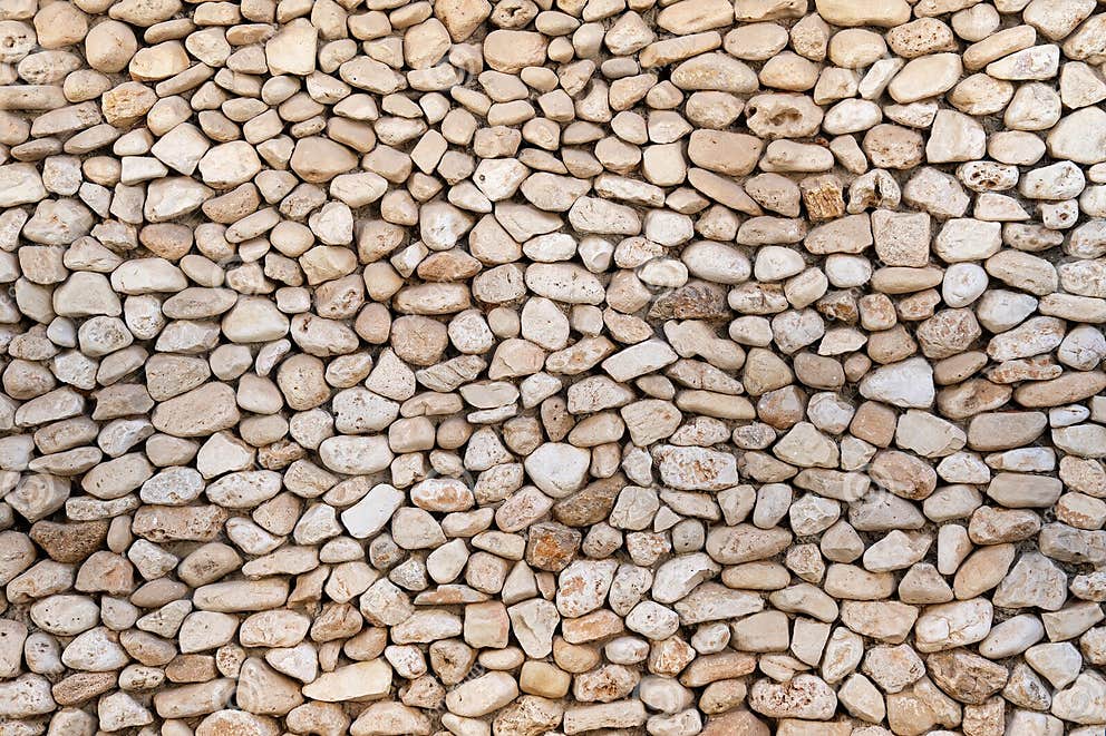 Wall with Oval-shaped Stones Background Stock Image - Image of surfaced ...