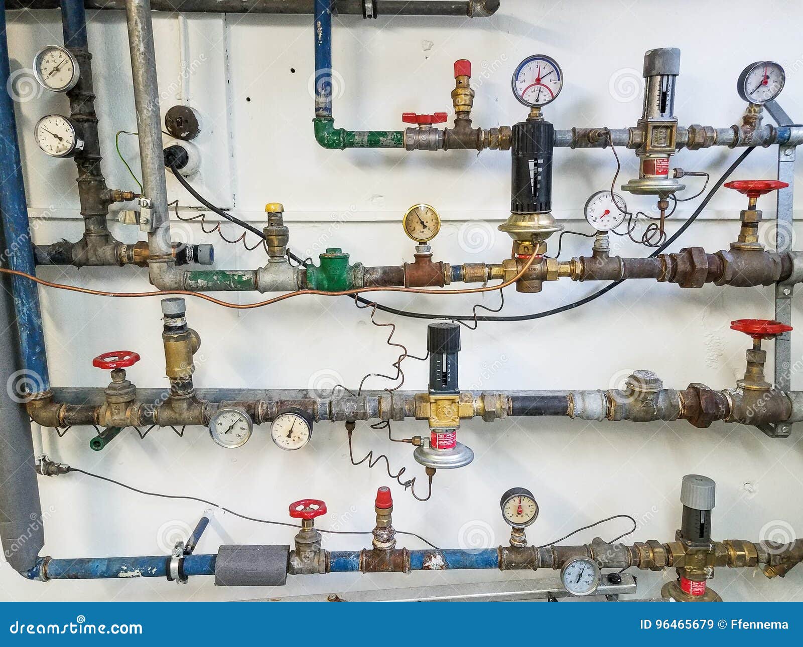 Wall with Plumbing Pipes and Many Gauges Stock Image - Image of modern ...