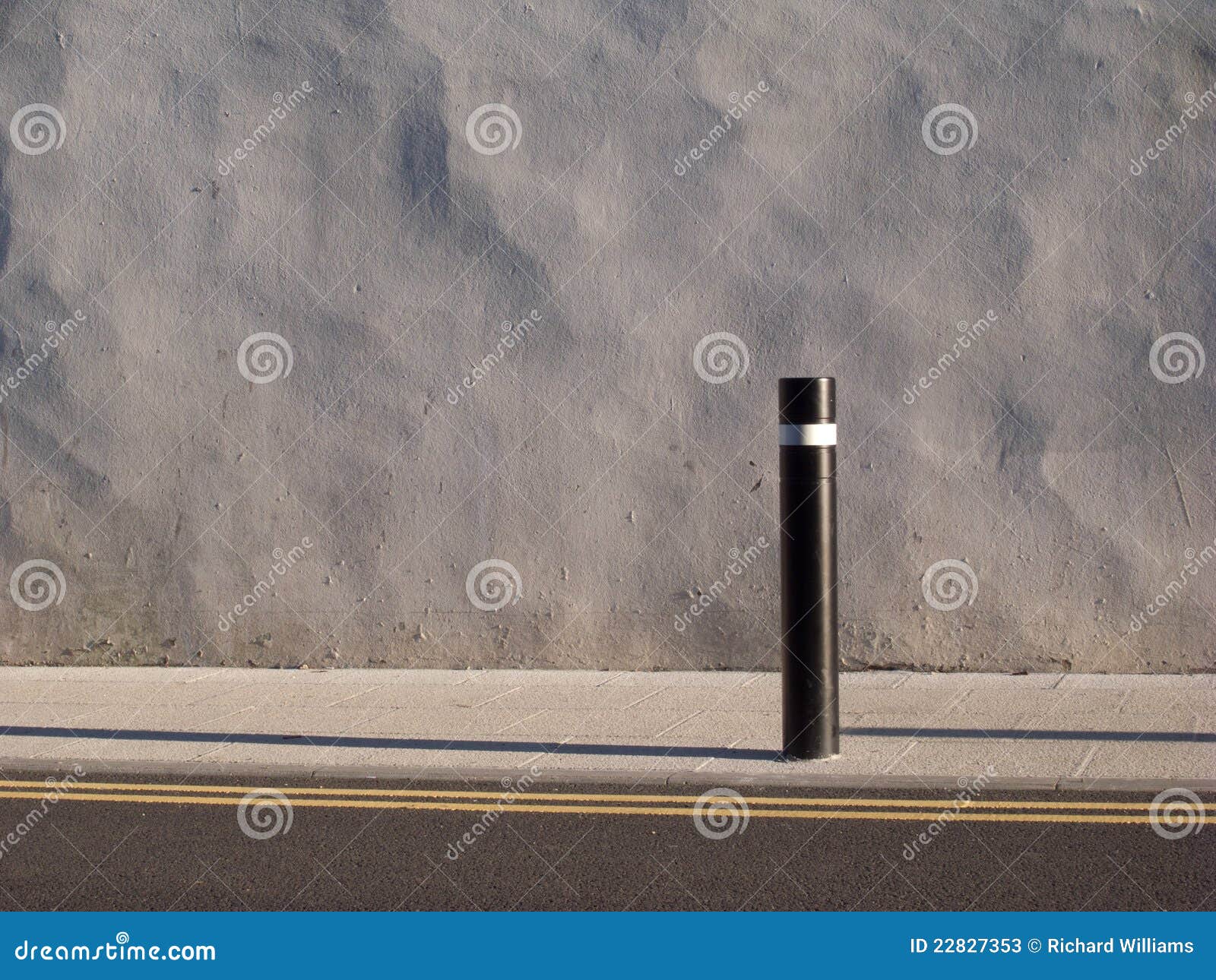 Wall, post, pavement. stock image. Image of road, uneven - 22827353