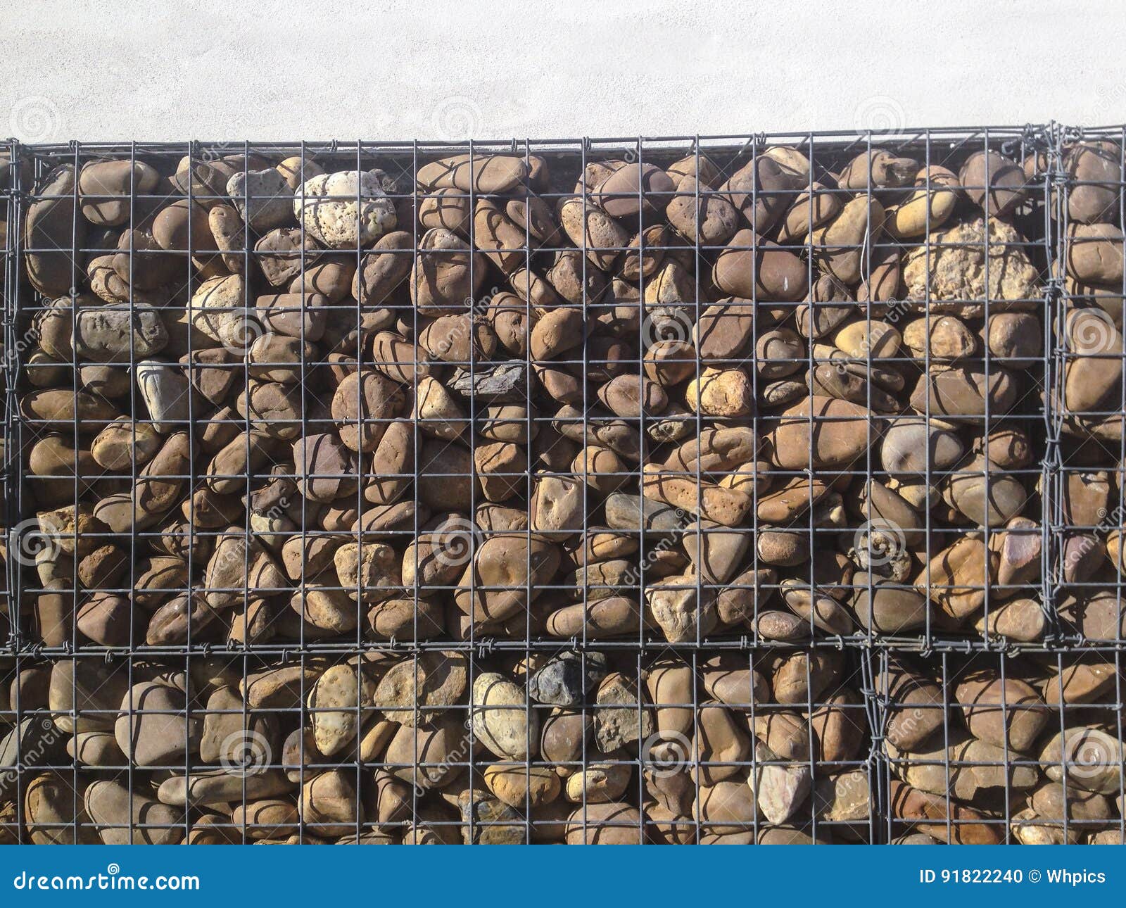 Wall Protected with River Pebble Stones in Iron Mesh Stock Photo ...