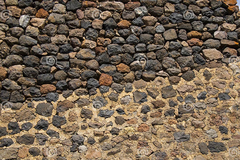 Wall with rock and stones stock photo. Image of pattern - 317640370