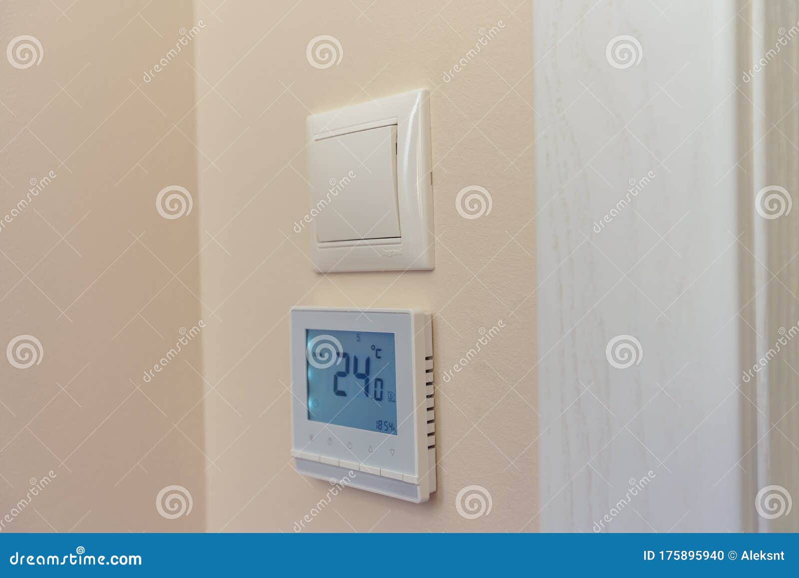 On the Wall of the Room There is a Light Switch and Under it a Floor ...