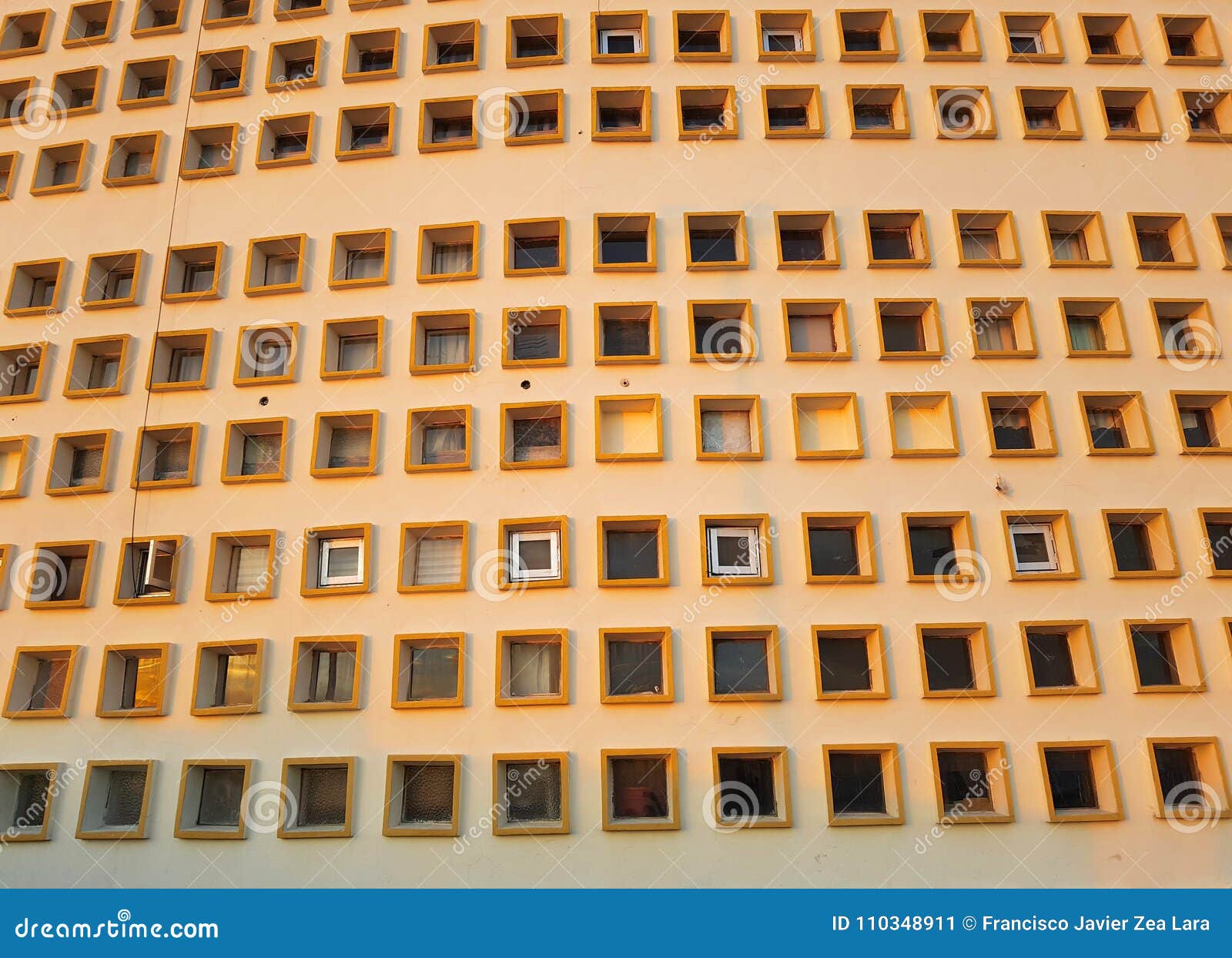 Wall with Small Square Windows, Painted in Yellow Stock Image - Image ...