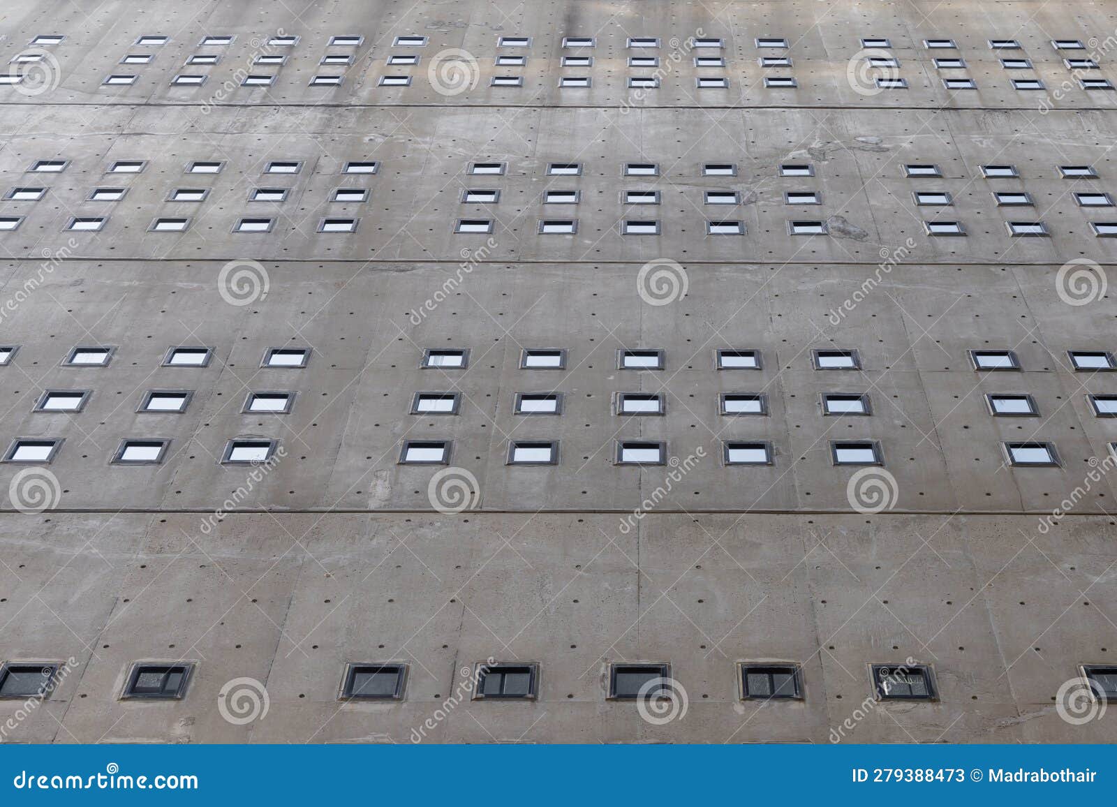 Wall with Small Windows of a Concrete Building Stock Image - Image of ...