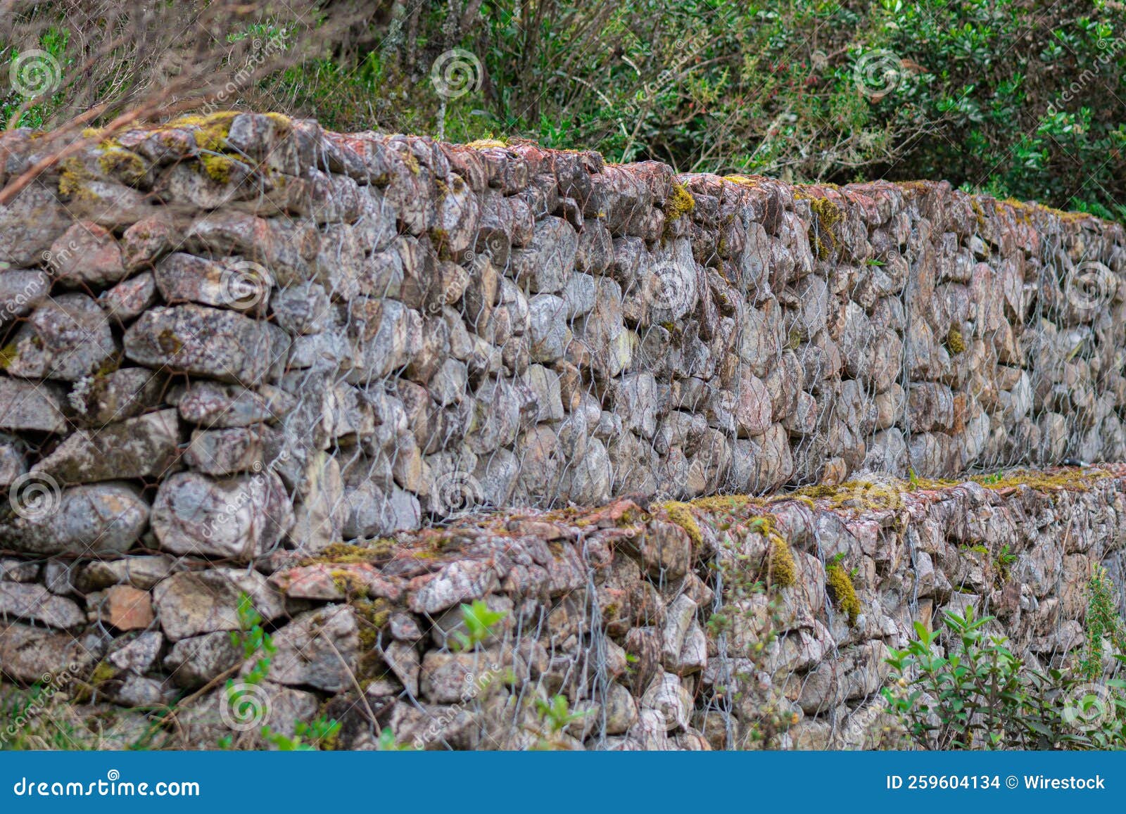 Wall with Stacked Rocks Covered with Net. Stock Photo - Image of ...