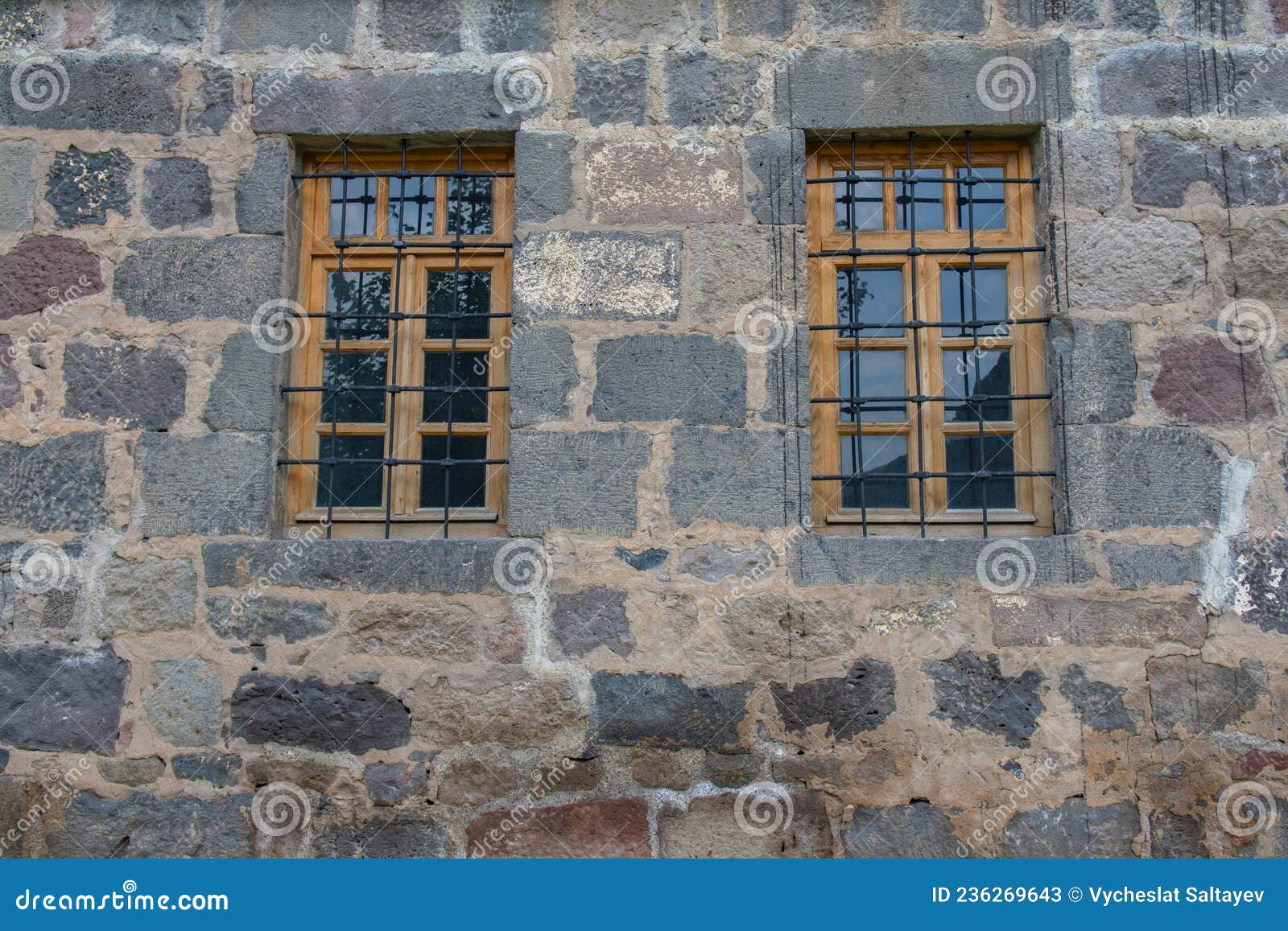 Wall of Stone of Different Texture with Windows and Bars Stock Image ...