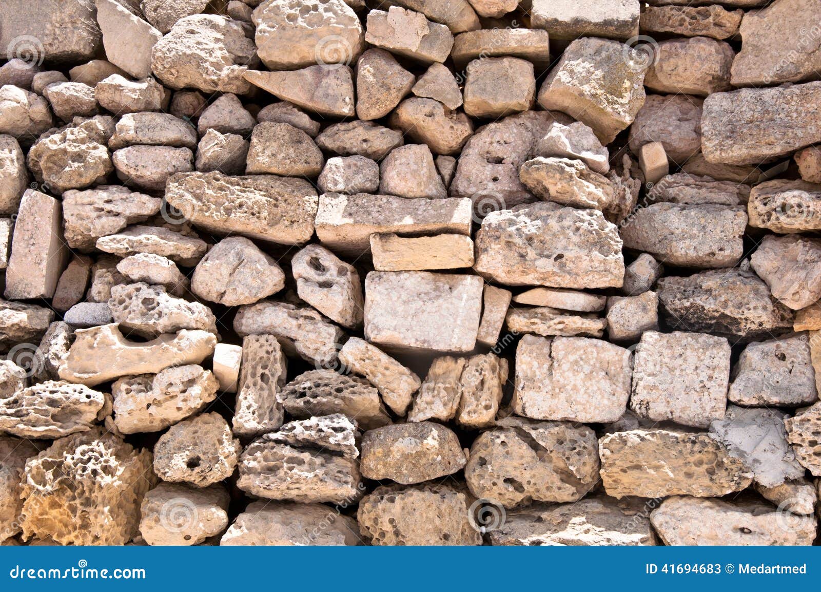 Wall of stones in Malta stock image. Image of front, time - 41694683