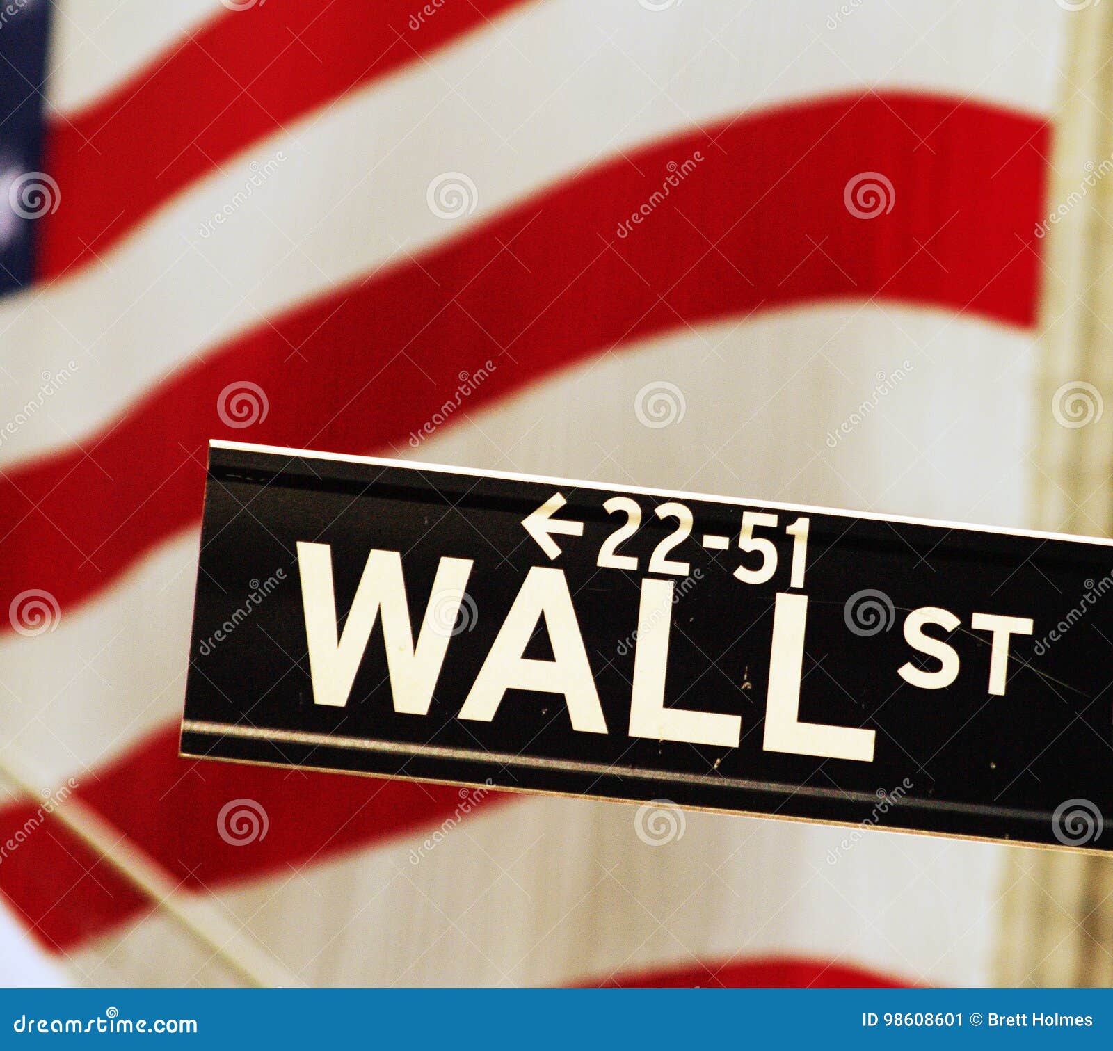 Wall Street sign with flag stock image. Image of landmark - 98608601