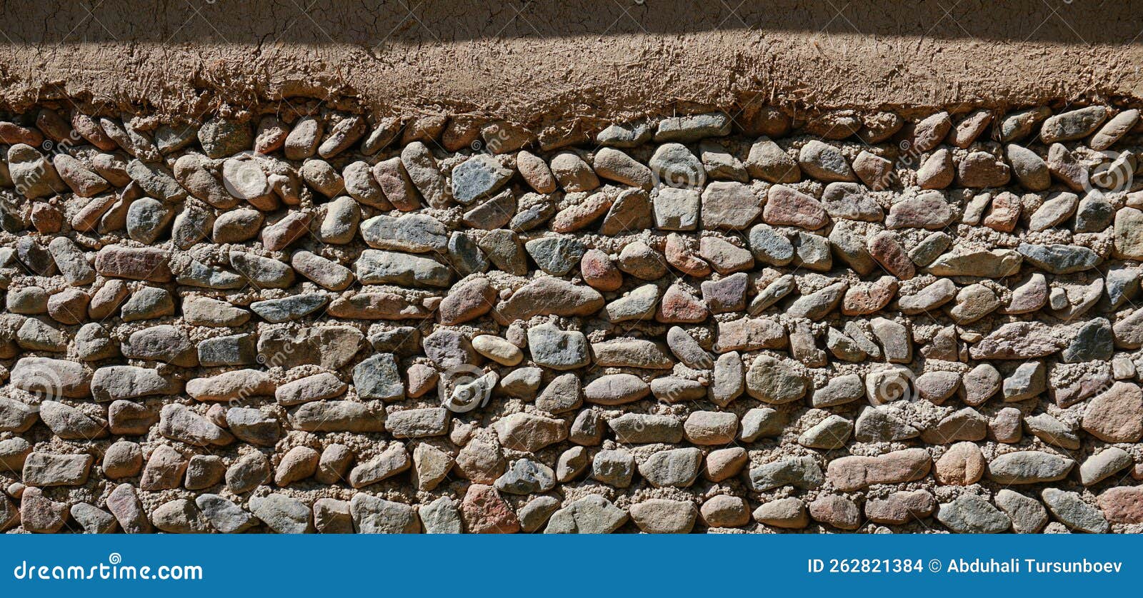 A Wall Structure Made of Round Stones Stock Photo - Image of material ...