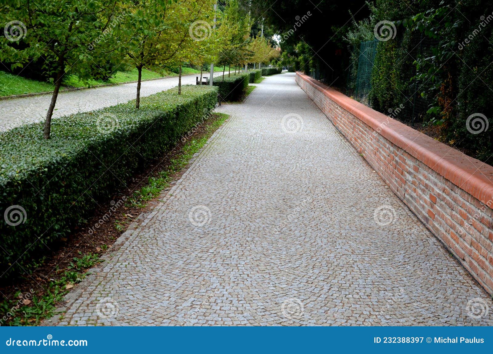 Wall with an Upper Edge Made of Atypical Rounded Fired Bricks. Street ...