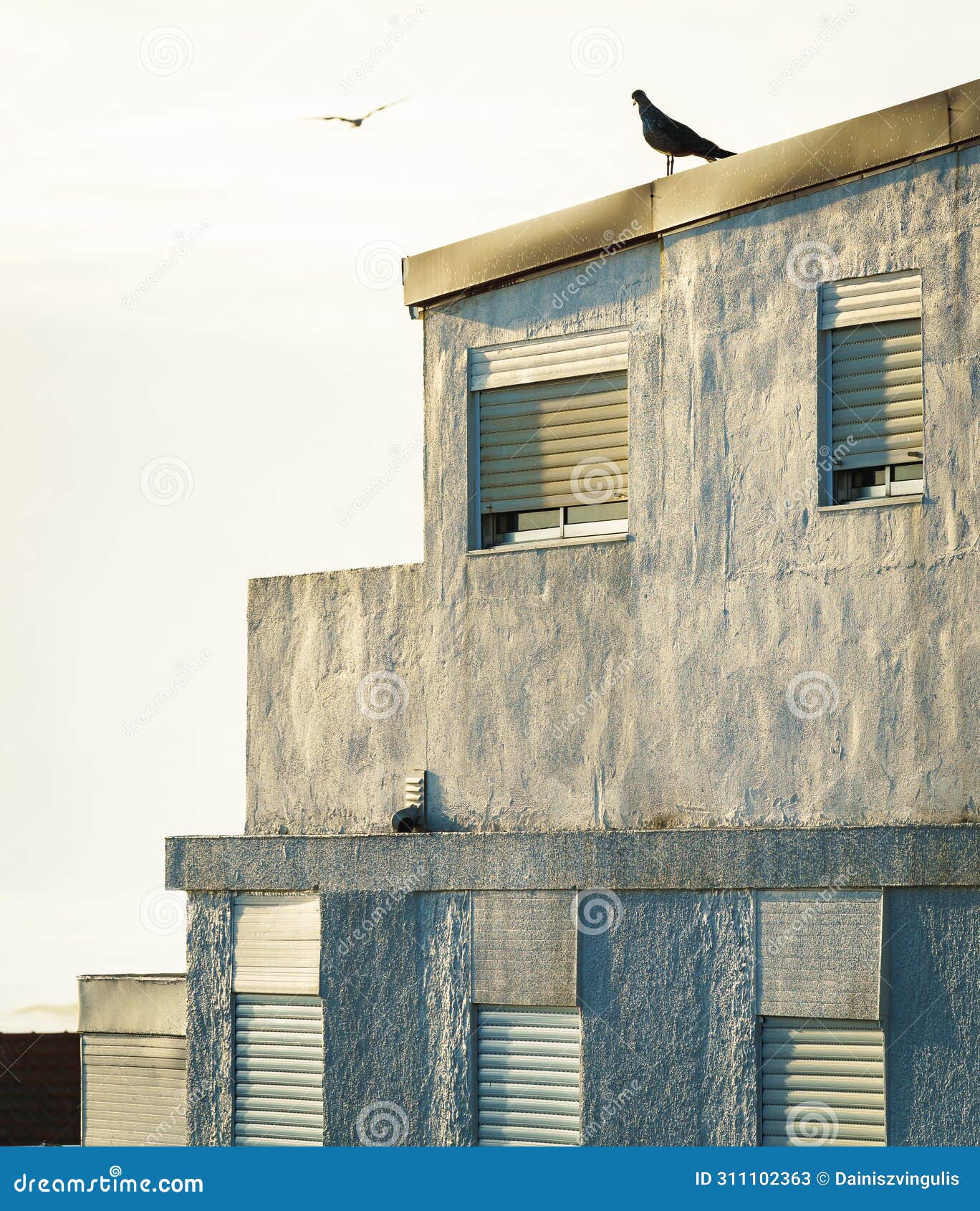 The Wall of a White Building, the Shutters are Lowered in Front of the ...