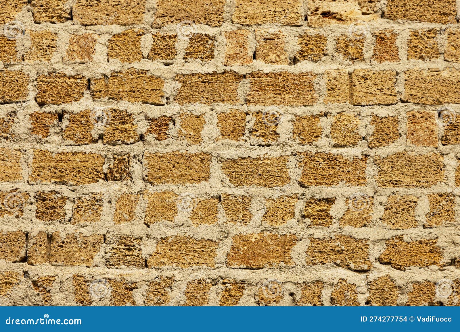 A Wall of Yellow Blocks, Textured Shell Bricks. Background Stock Photo ...