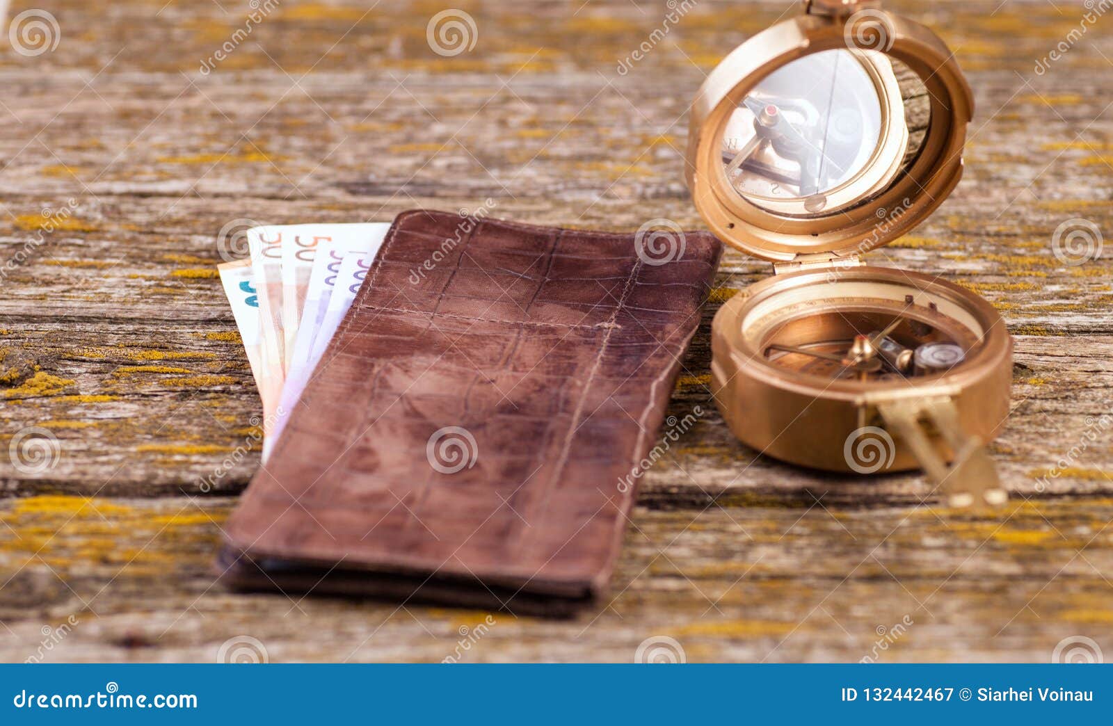 A Wallet, Money and Other Items are on the Table of Old Boards Stock ...