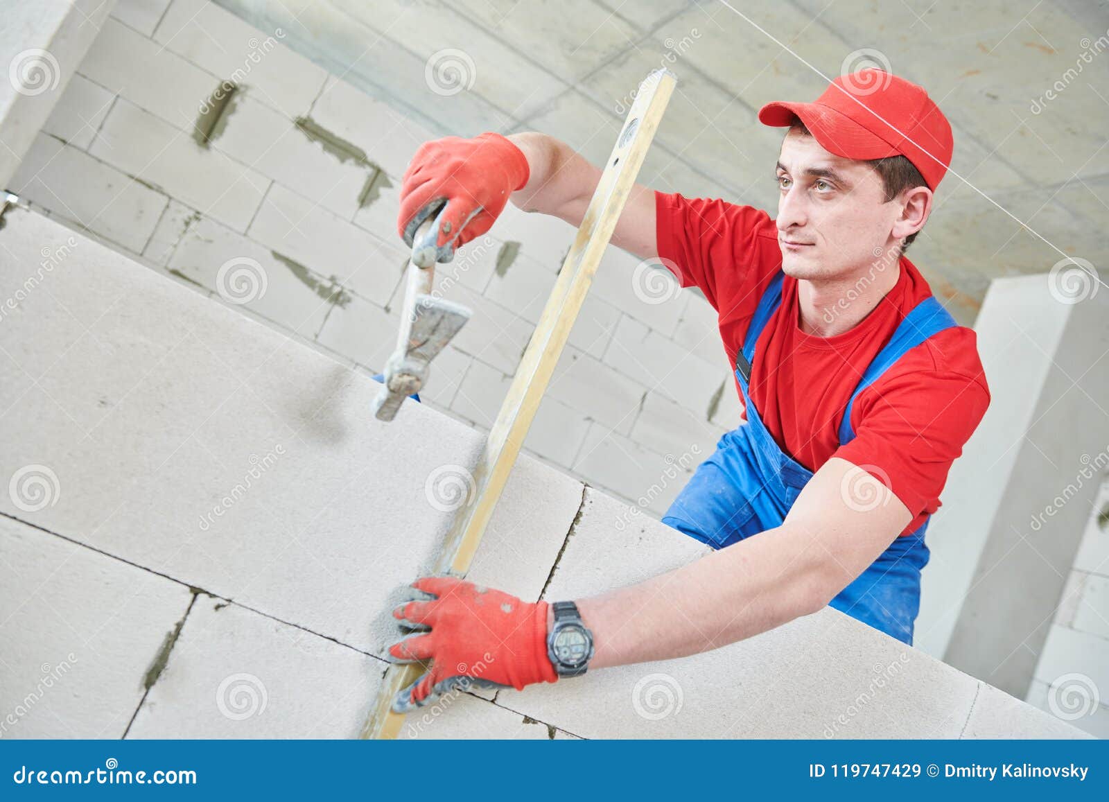 Walling. Bricklayer Installing Wall from Autoclaved Aerated Concrete ...