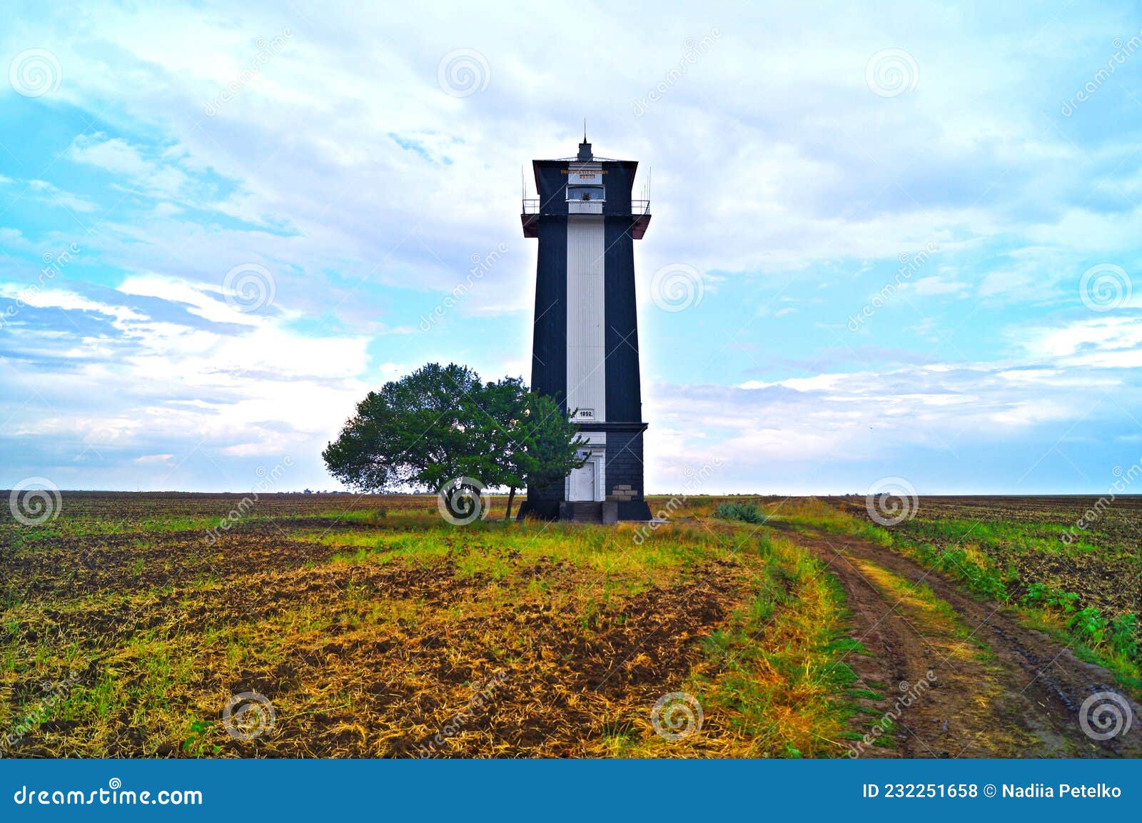 Wallpaper Lighthouse in the Field Background Stock Photo - Image of ...