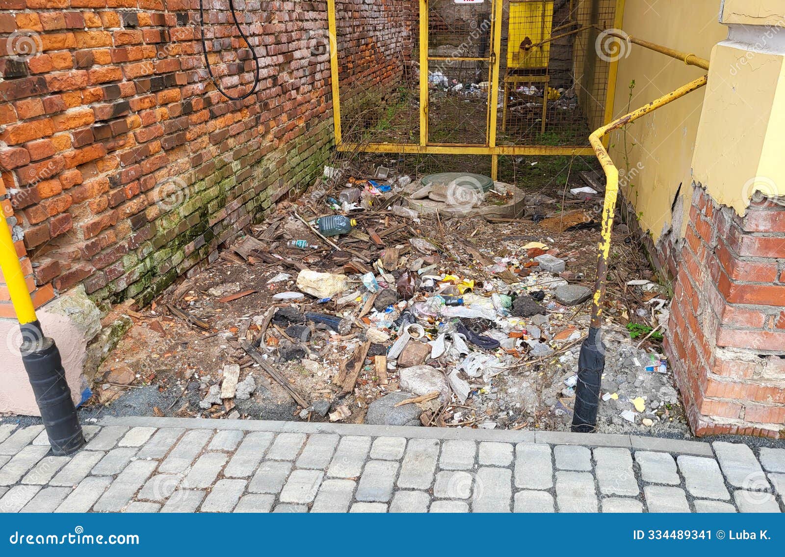 The Walls of a Brick House. Garbage is Lying between the Houses. Stock ...