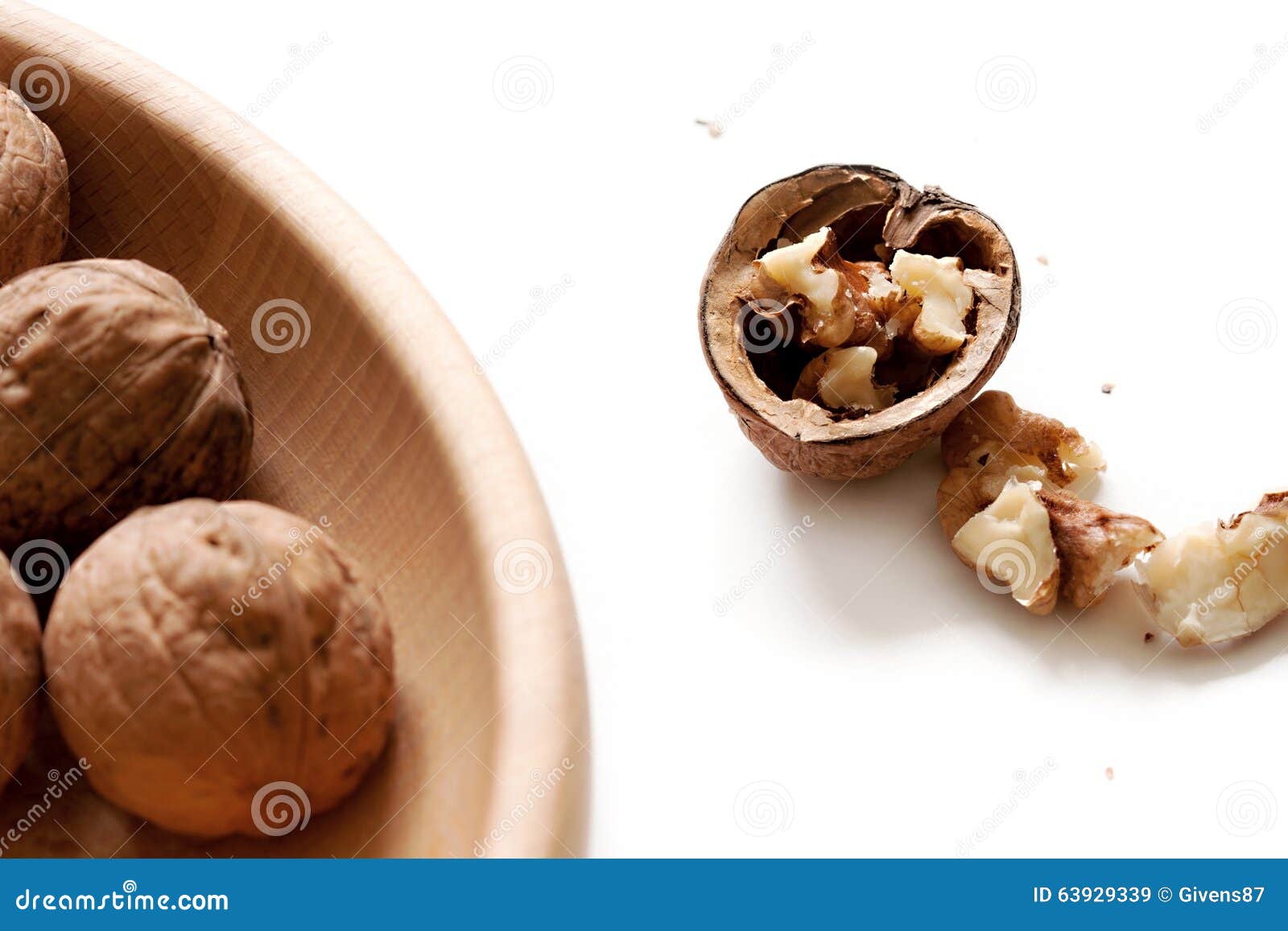Walnut Cracked Open with Several Whole Walnuts on White Background ...