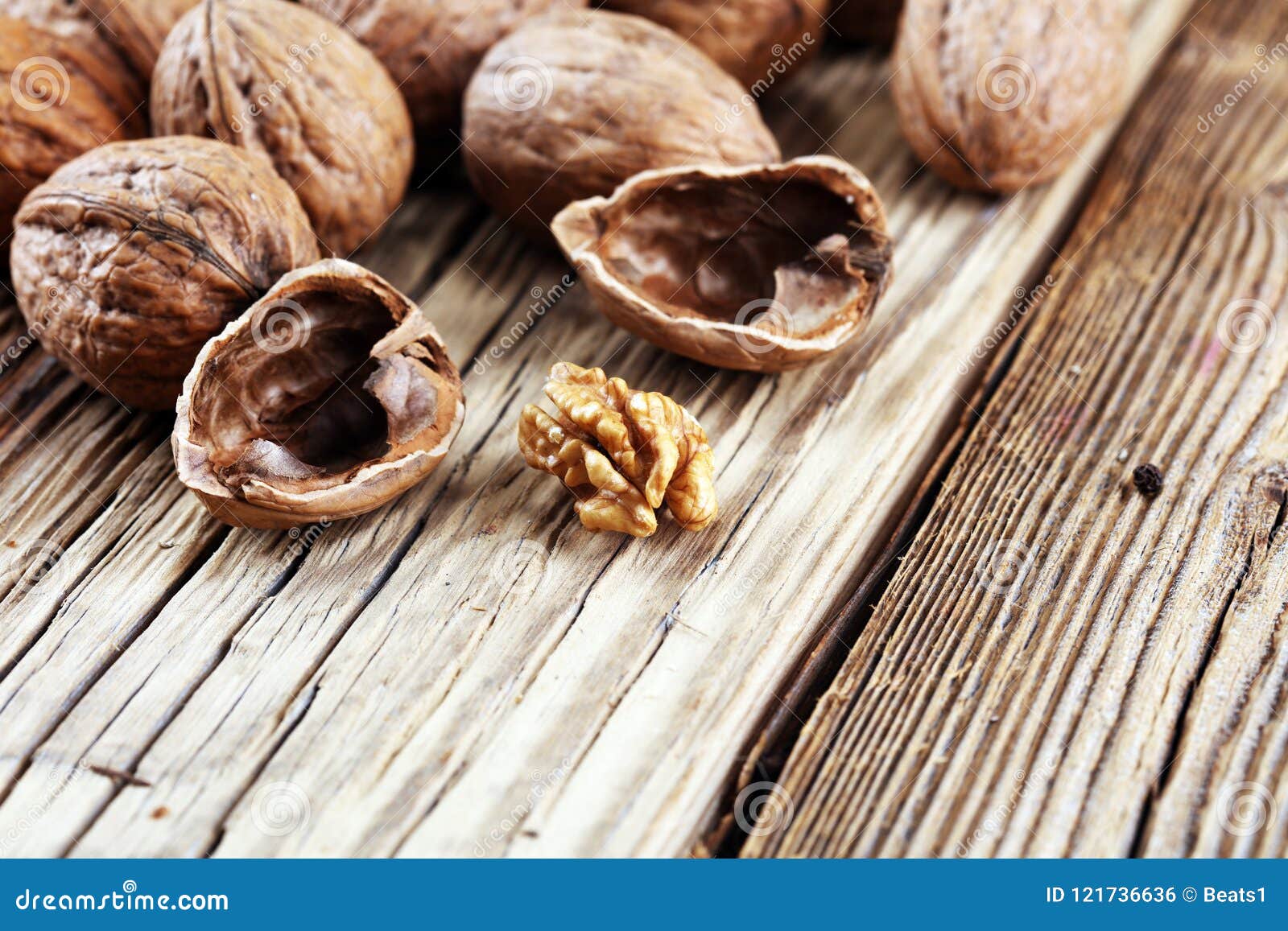Walnut Kernels and Whole Walnuts on Rustic Old Table. Stock Photo ...