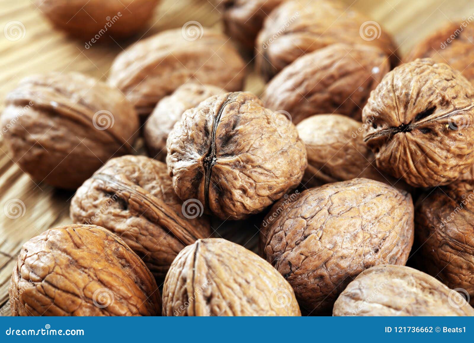 Walnut Kernels and Whole Walnuts on Rustic Old Table. Stock Photo ...